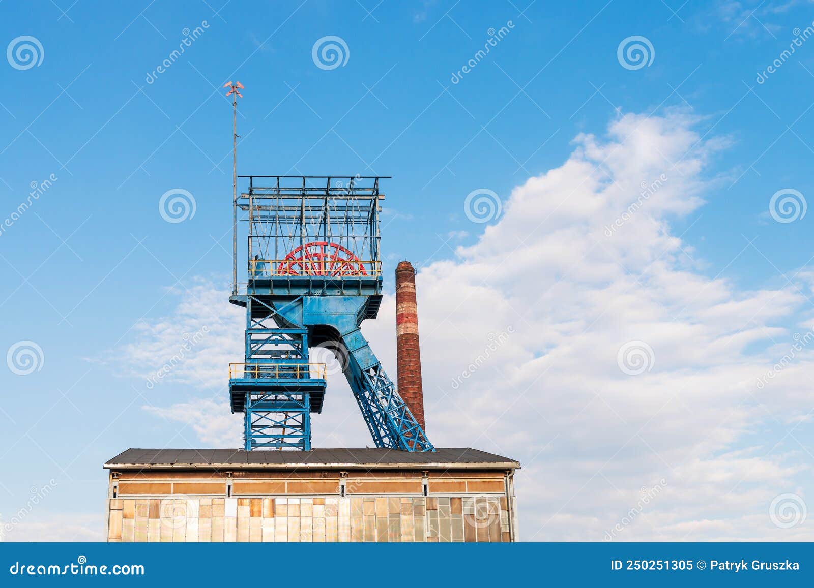 Old Rusty Coal Mine Shaft. in the Background the Chimney of the Heating ...
