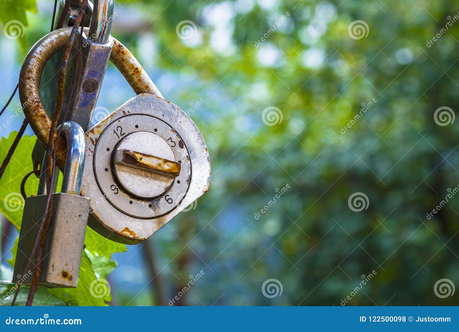 Old and Rusty Combination Locks Attached To Locks. Stock Photo - Image ...