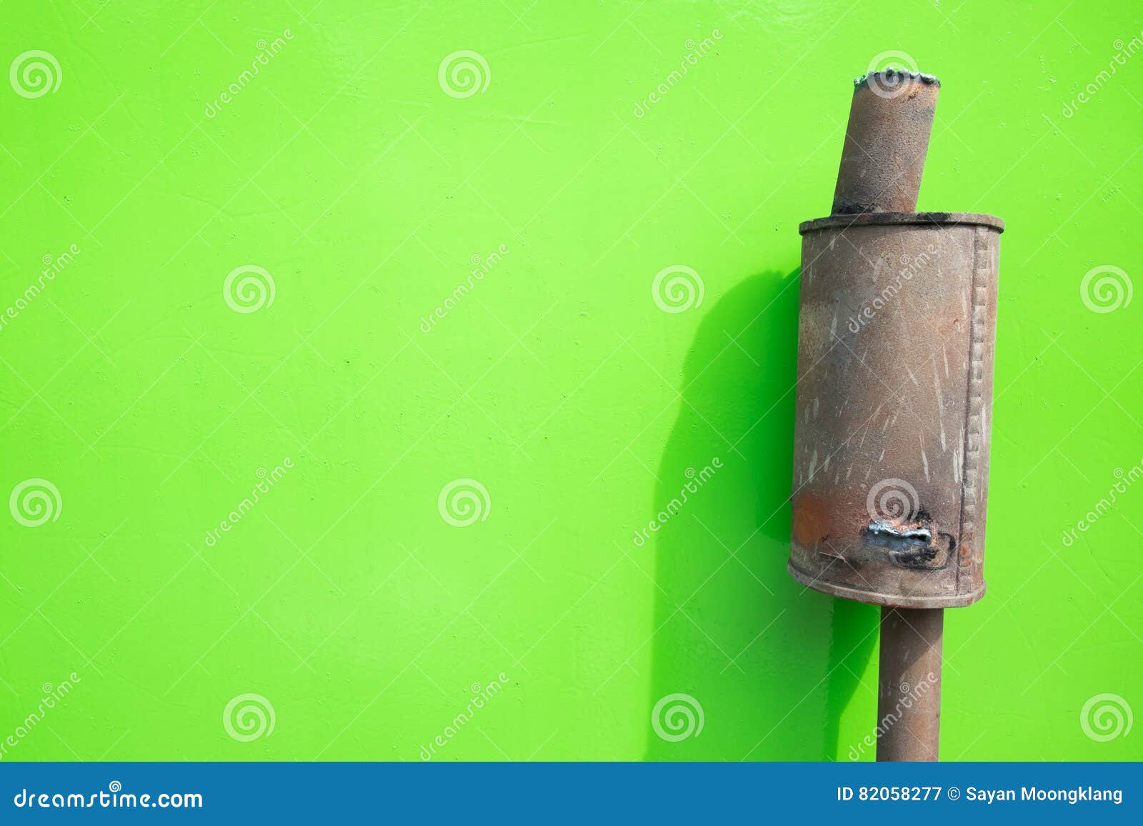 Old Rusty Exhaust Pipe on Green Wall. Stock Image - Image of aged ...