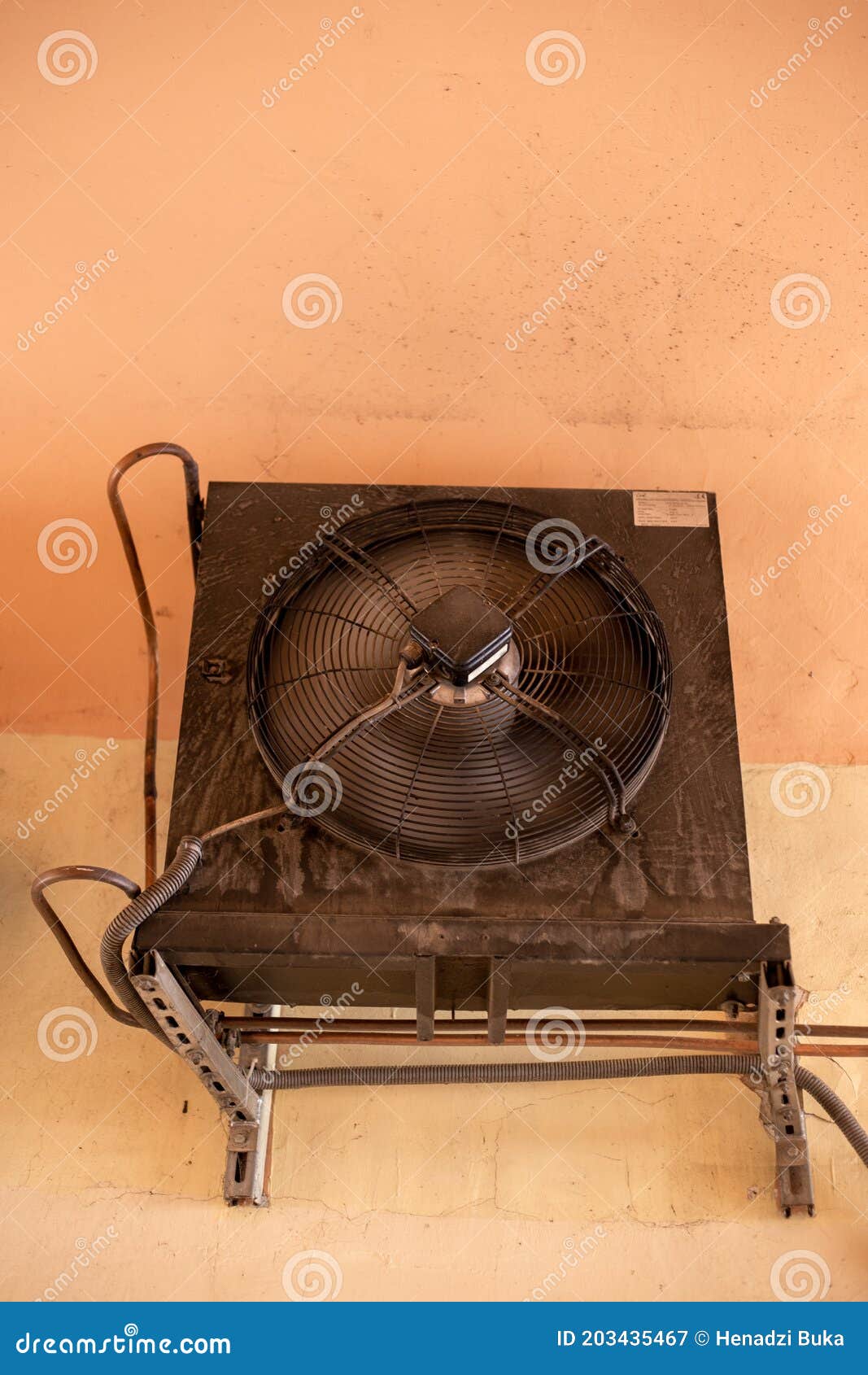 Old Rusty Fan on the Wall of a Building Stock Image - Image of ...