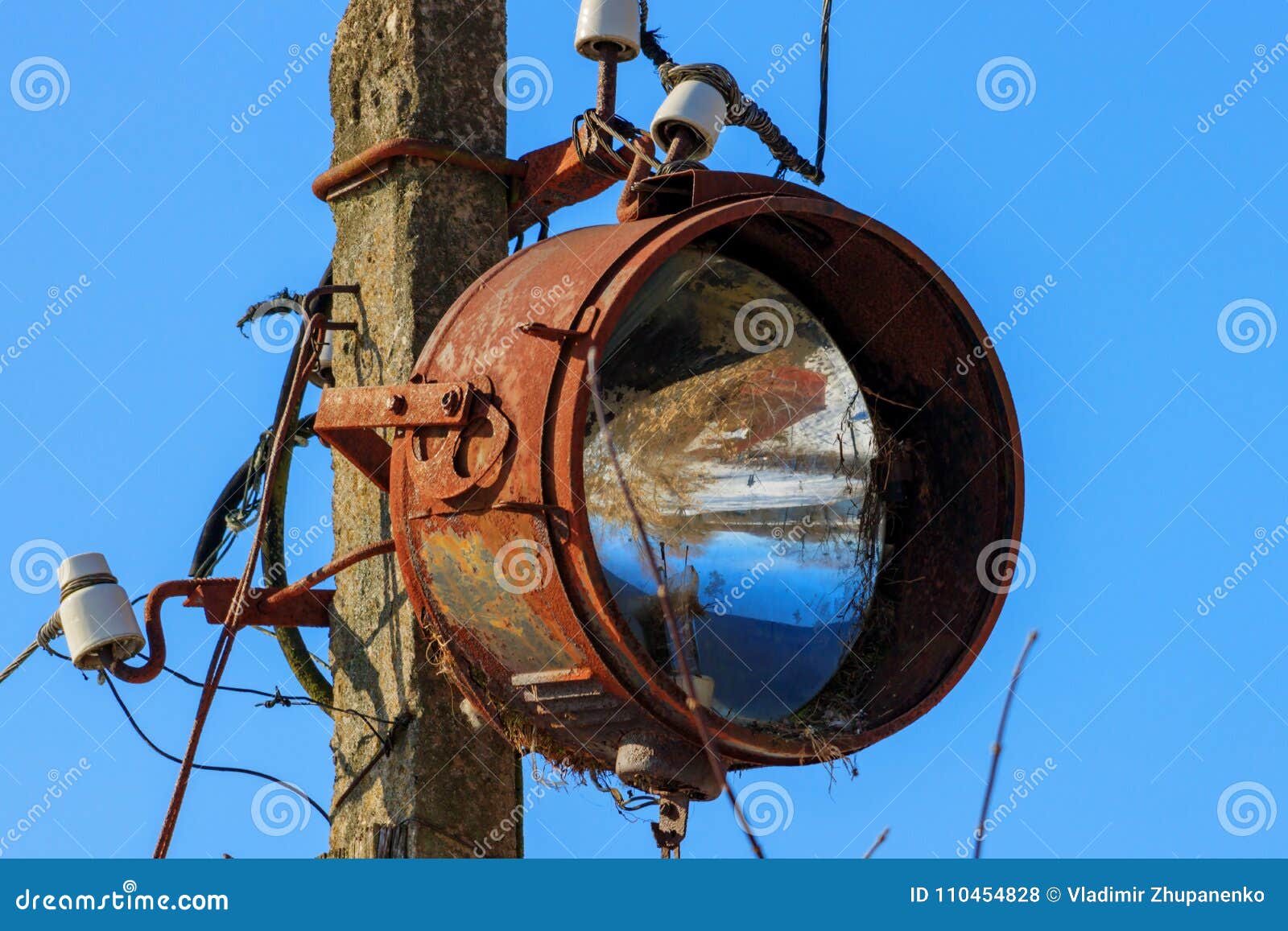Old Rusty Floodlight Mounted on a Support of Electricity Transmissions ...