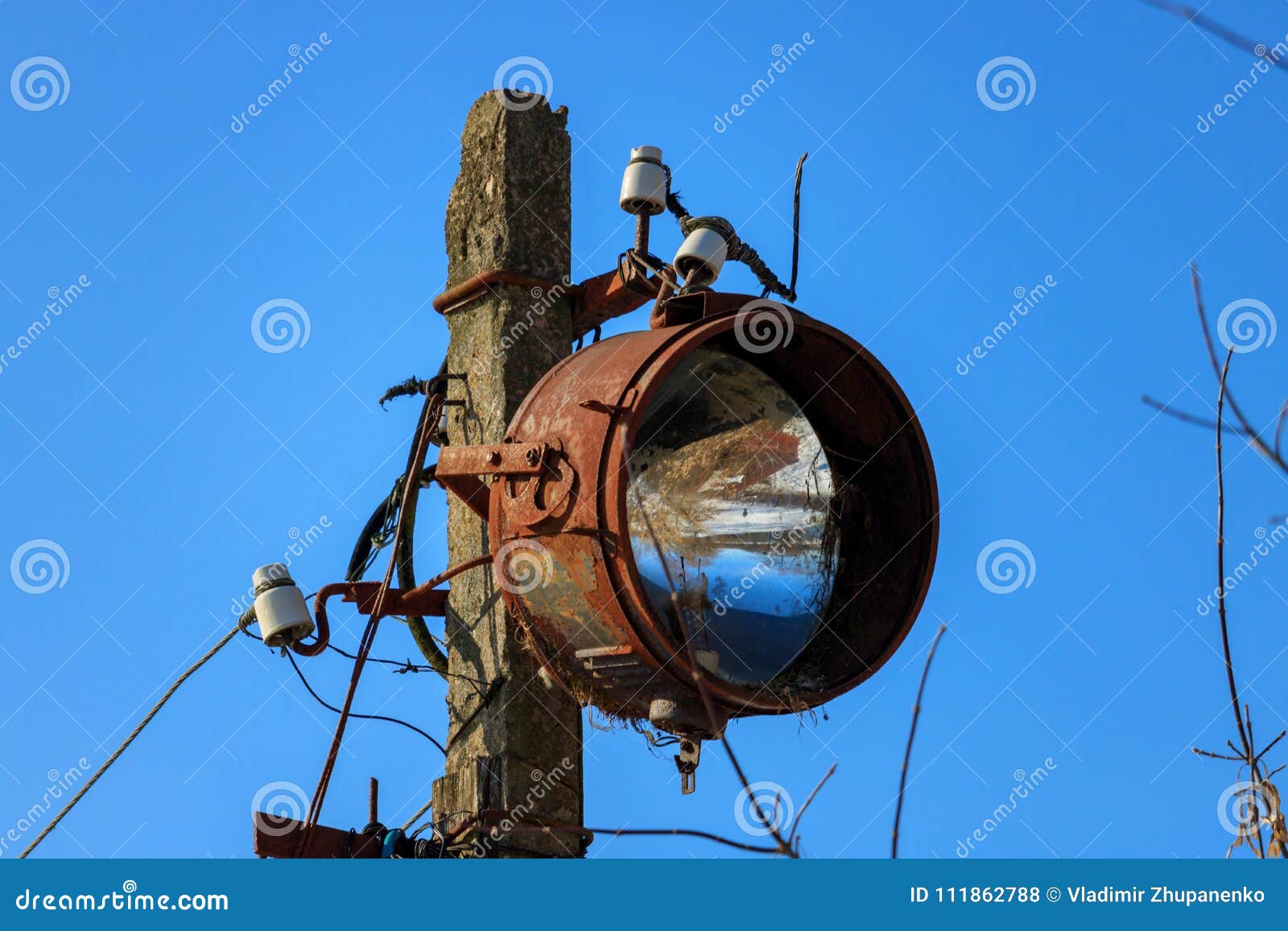 Old Rusty Floodlight Mounted on a Support of Electricity Transmissions ...