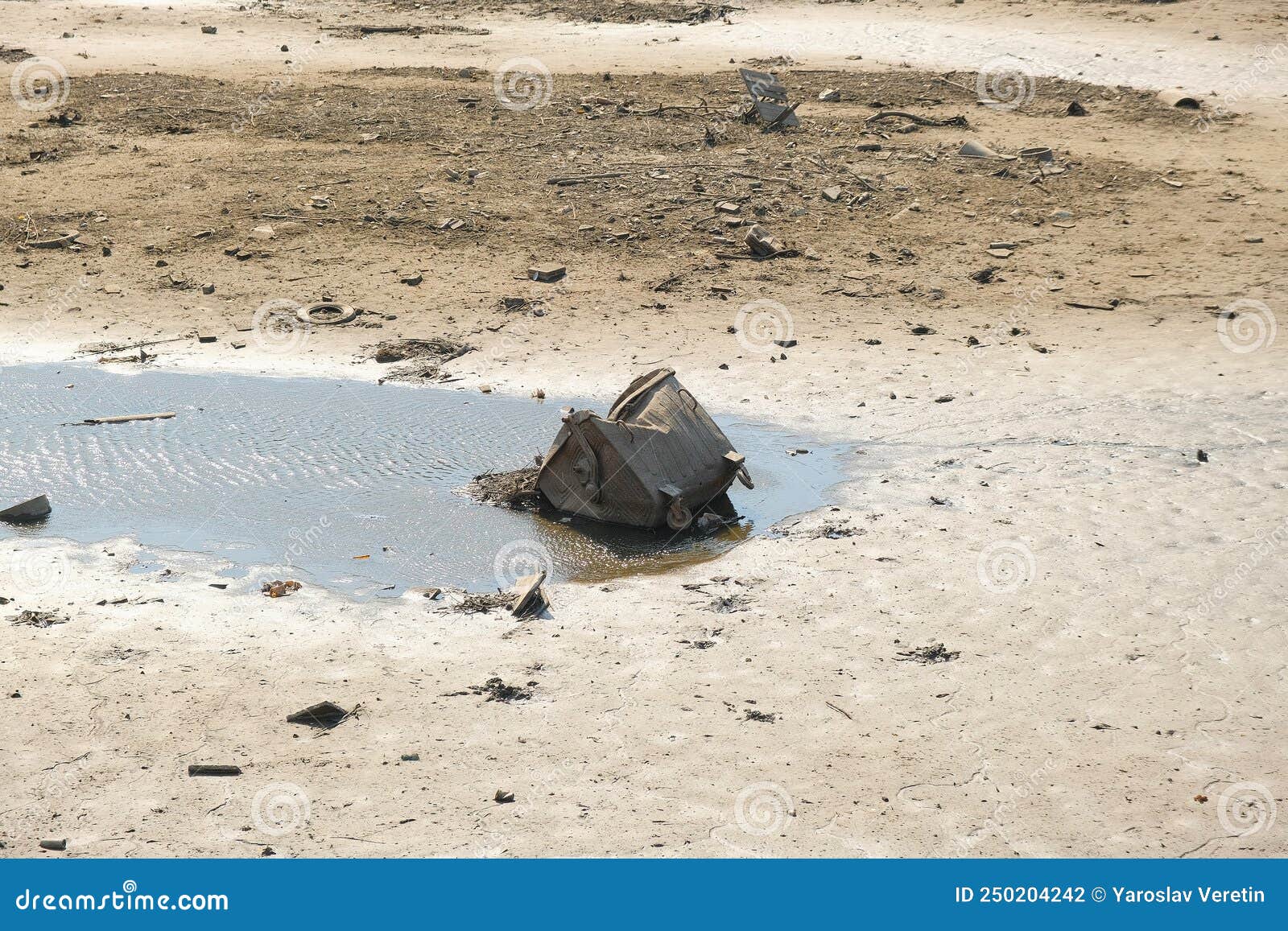 Old Rusty Garbage Bin Tipped Over Polluting the Water Stock Photo ...