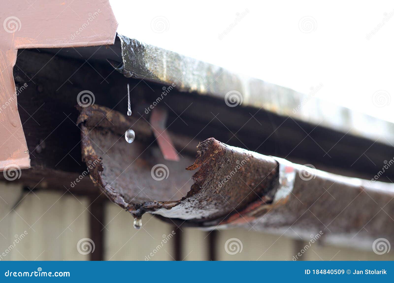 Old Rusty Gutter in the Rain Stock Image - Image of rusty, gutter ...