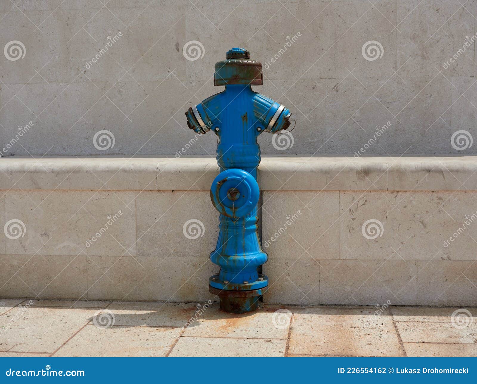 An Old, Rusty, Historic and Blue Fire Hydrant Standing on a Stone ...