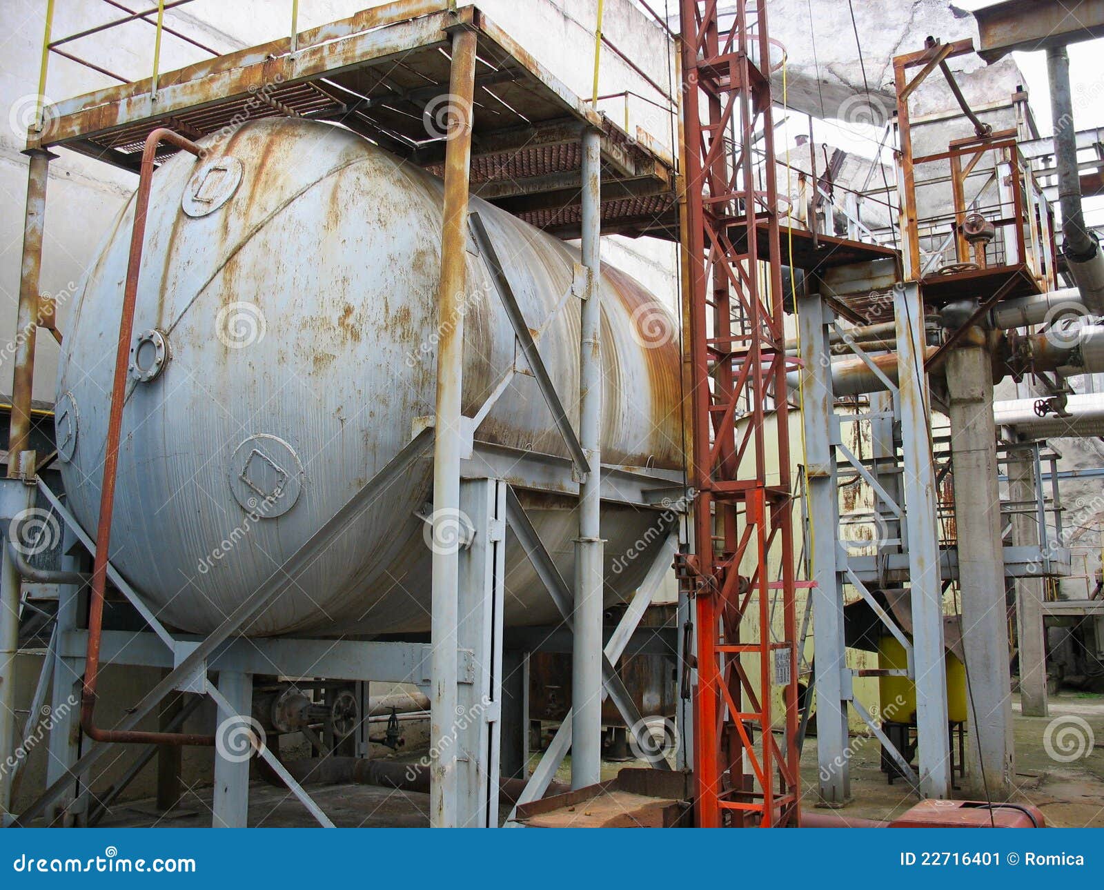 Old Rusty Industrial Tanks Connected By Pipes Connected With Valves In ...