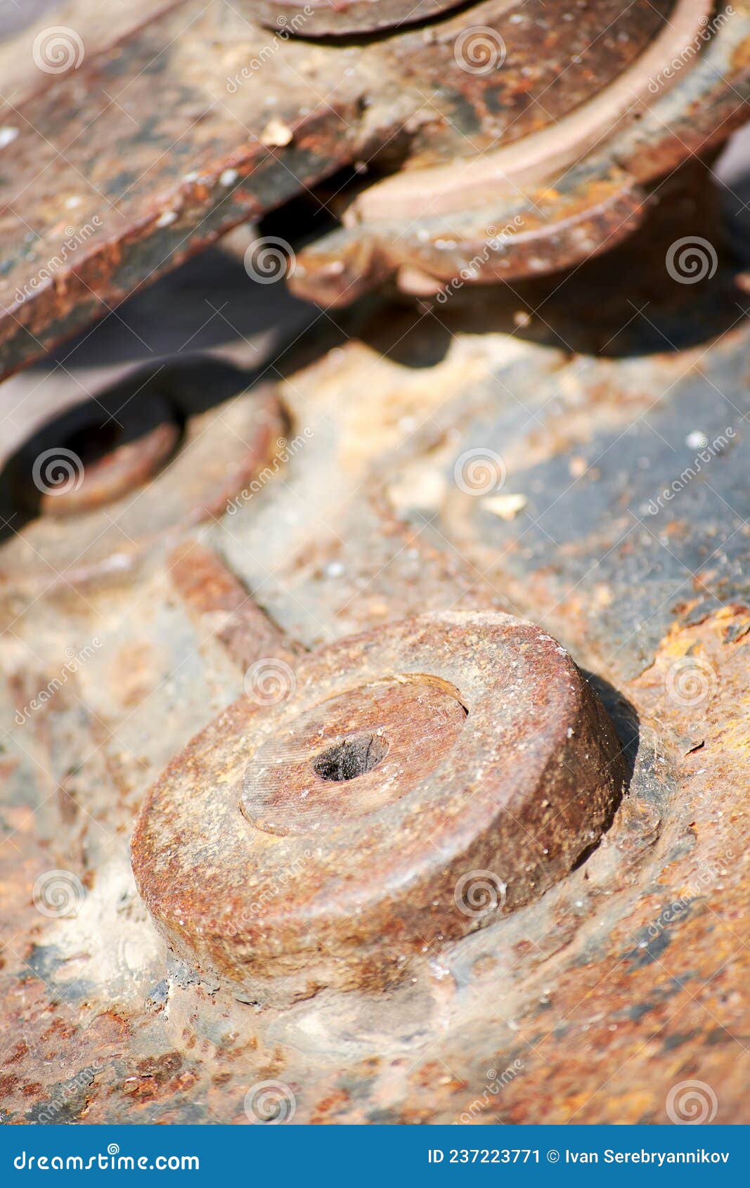 Red Rusty Jack Stand On A Table With Another Used Engine Part In A ...