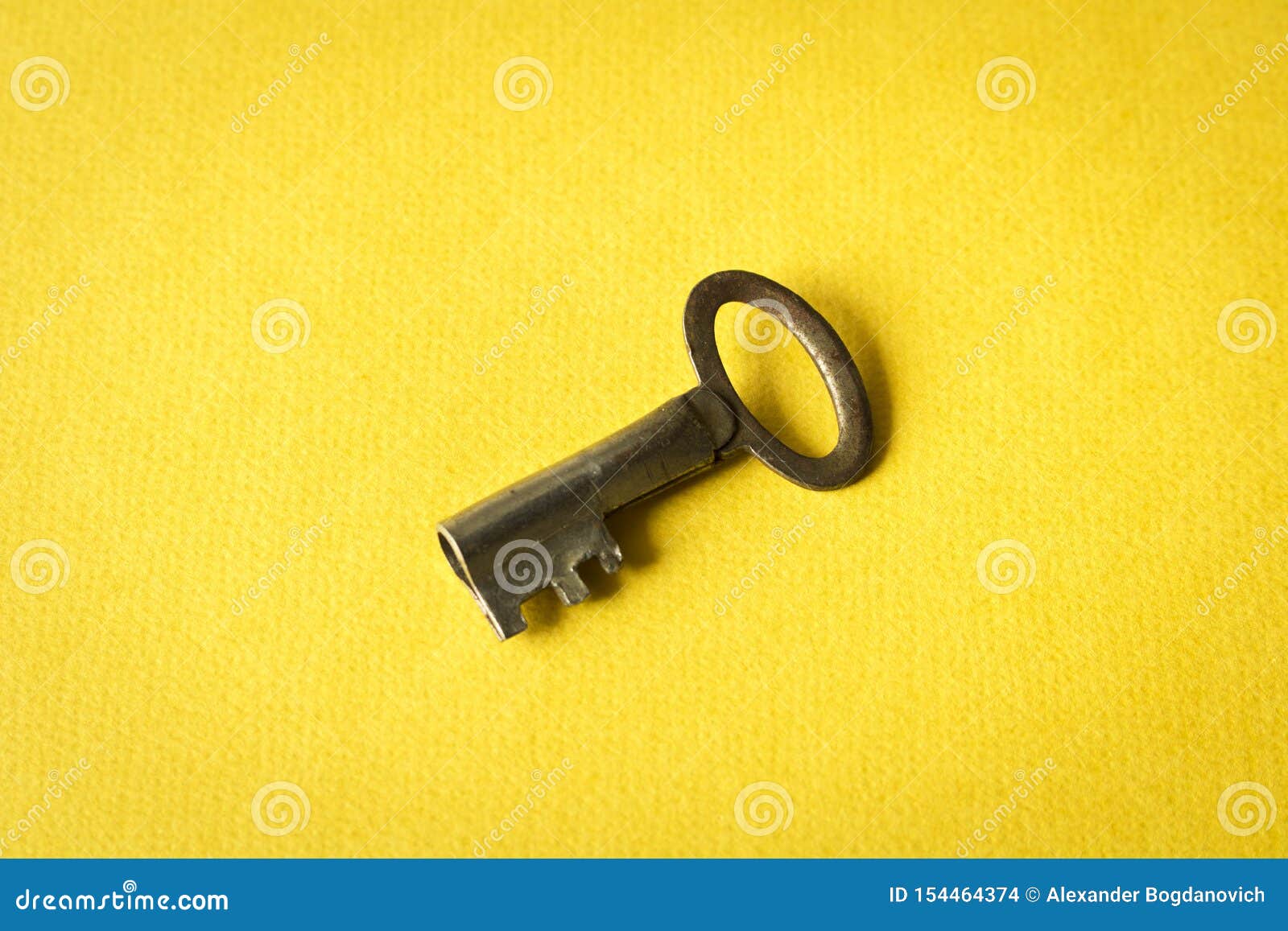 Old Rusty Key on Yellow Background. Key Isolated on Yellow Background ...