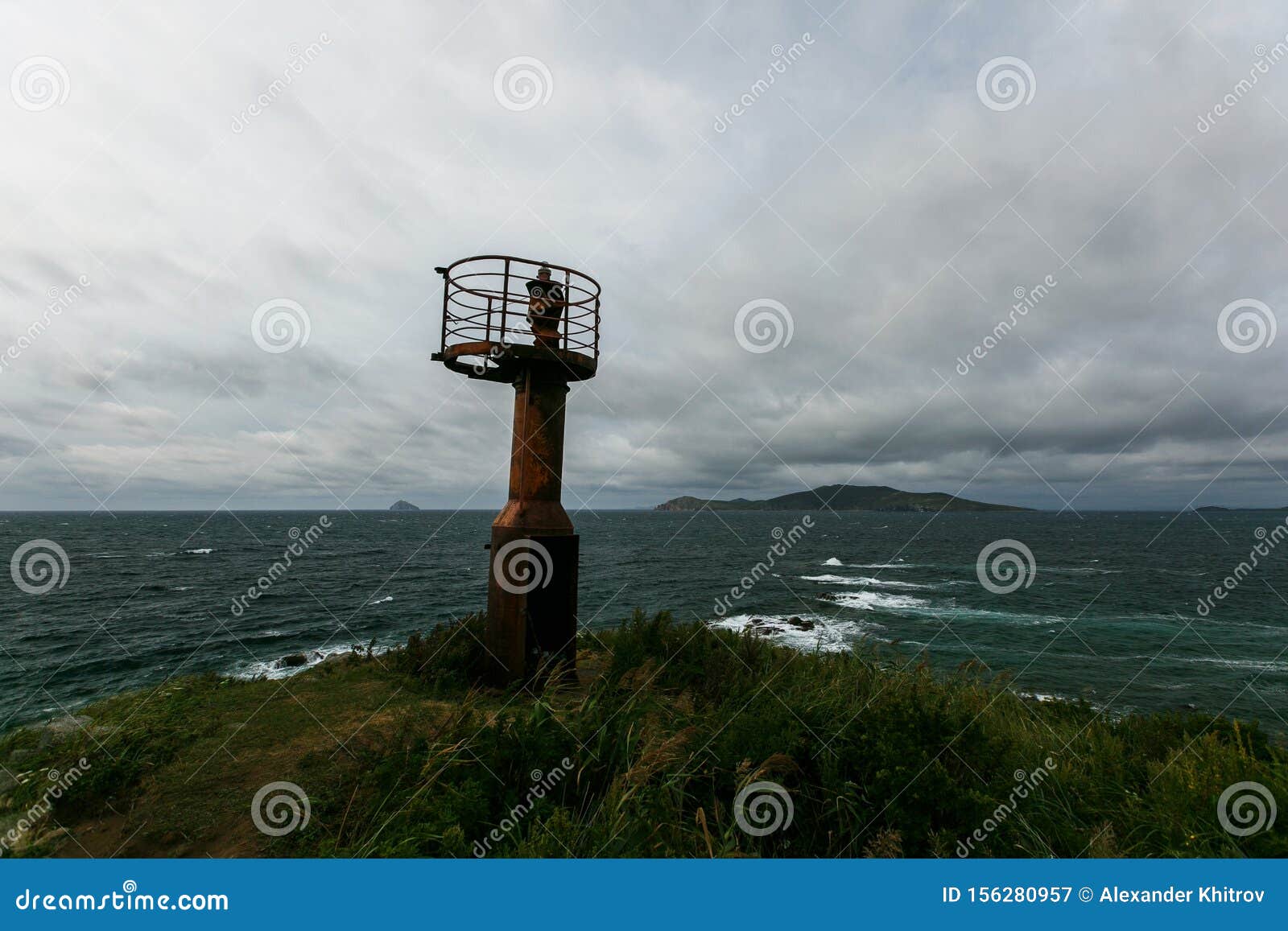 Old Rusty Lighthouse on a Rocky Coast Stock Image - Image of closeup ...