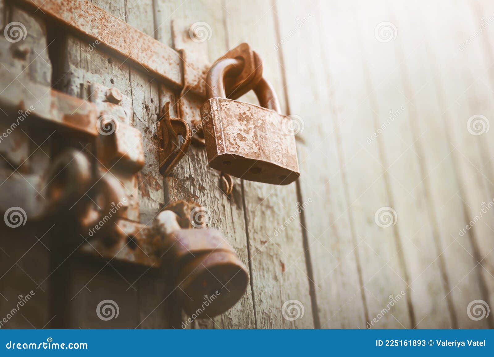 An Old Rusty Lock Hangs on the Old Painted Gate, Closing it ...