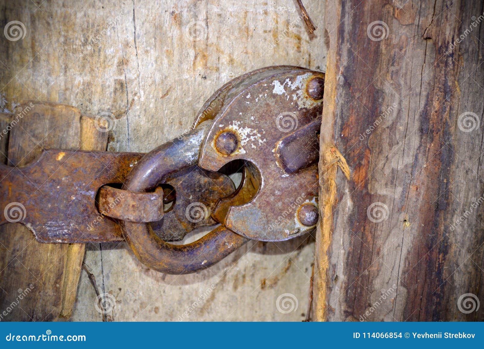 Old rusty lock with rivets stock photo. Image of rusty - 114066854