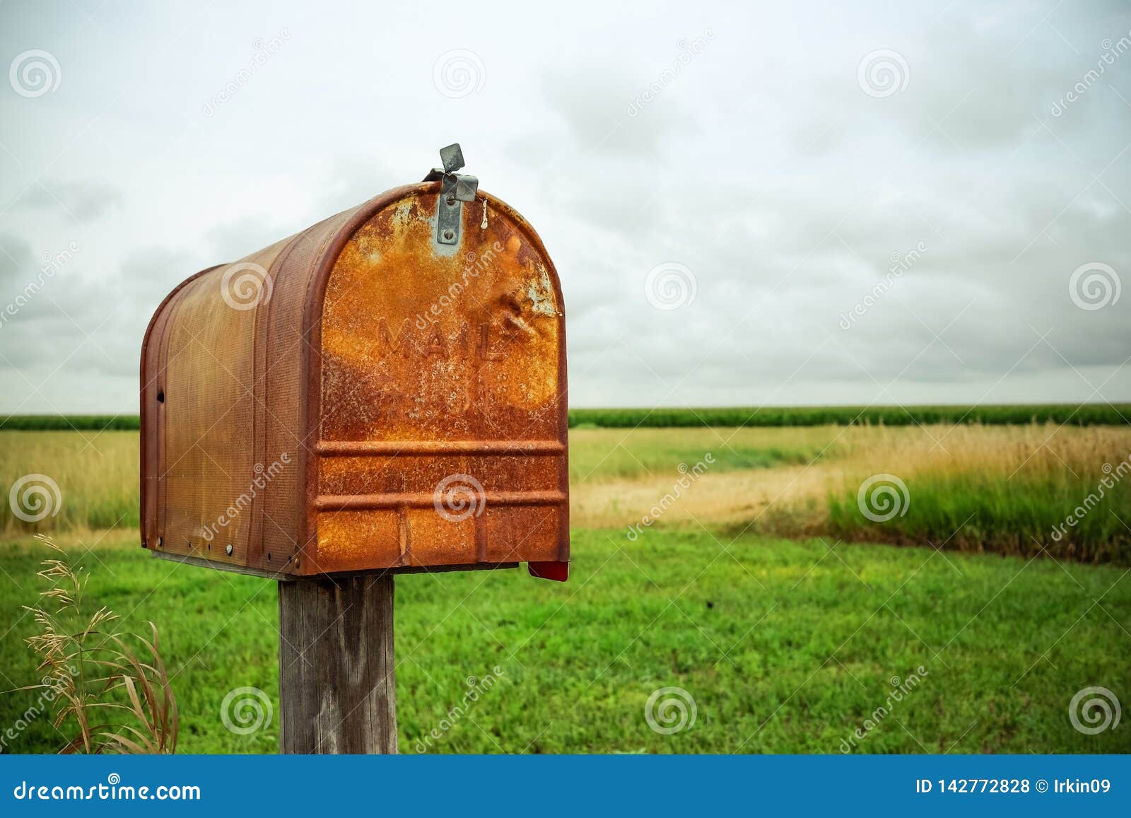 An Old Rusty Mailbox in a Field. Stock Photo - Image of arrive, hills ...