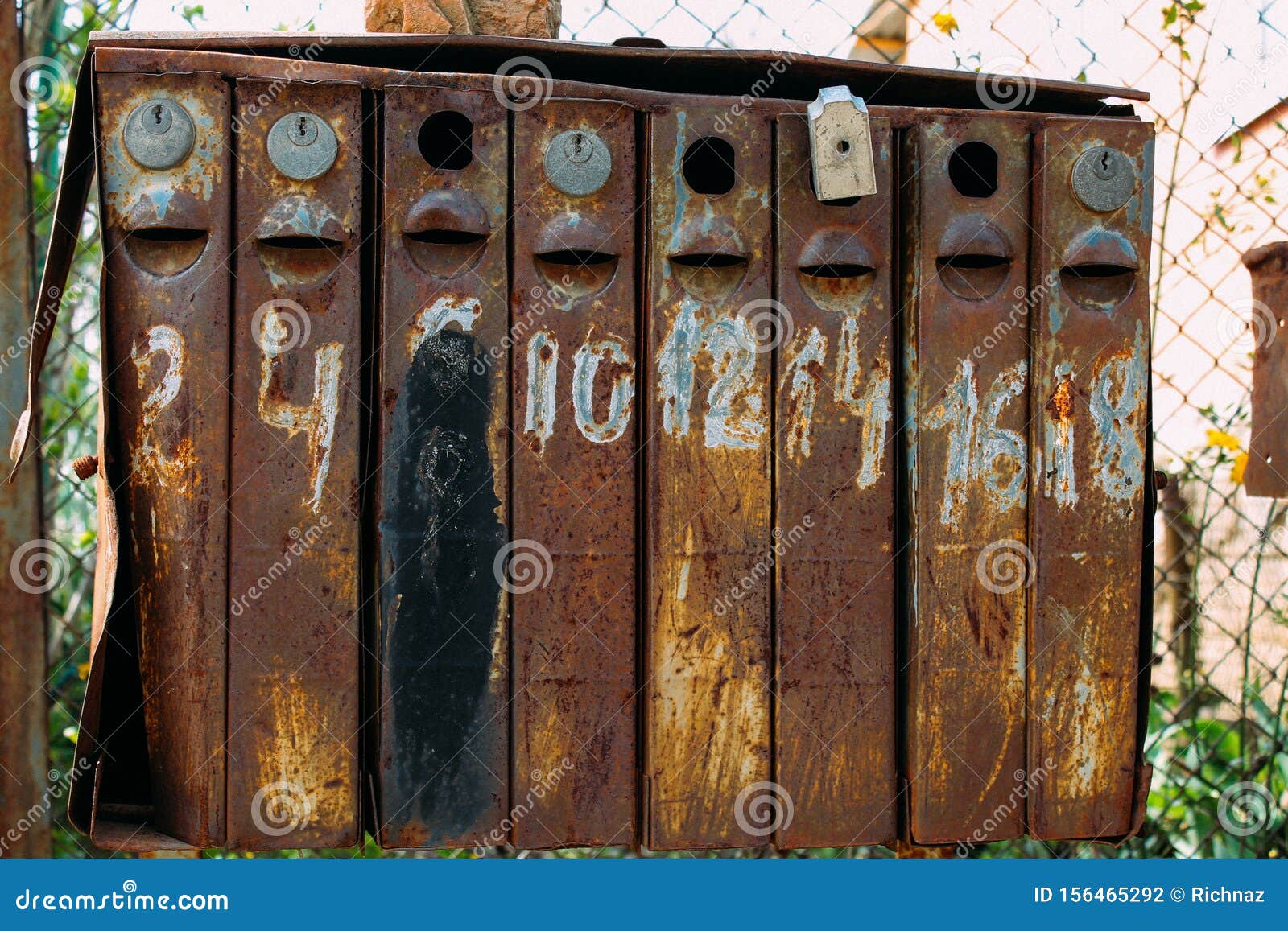 Old and Rusty Mailbox with Locks and Figures Stock Photo - Image of ...