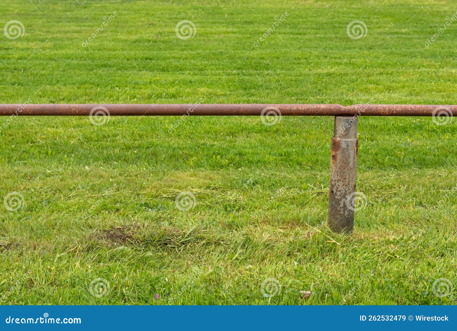 Old Rusty Metal Fence on a Green Meadow Stock Image - Image of pipe ...