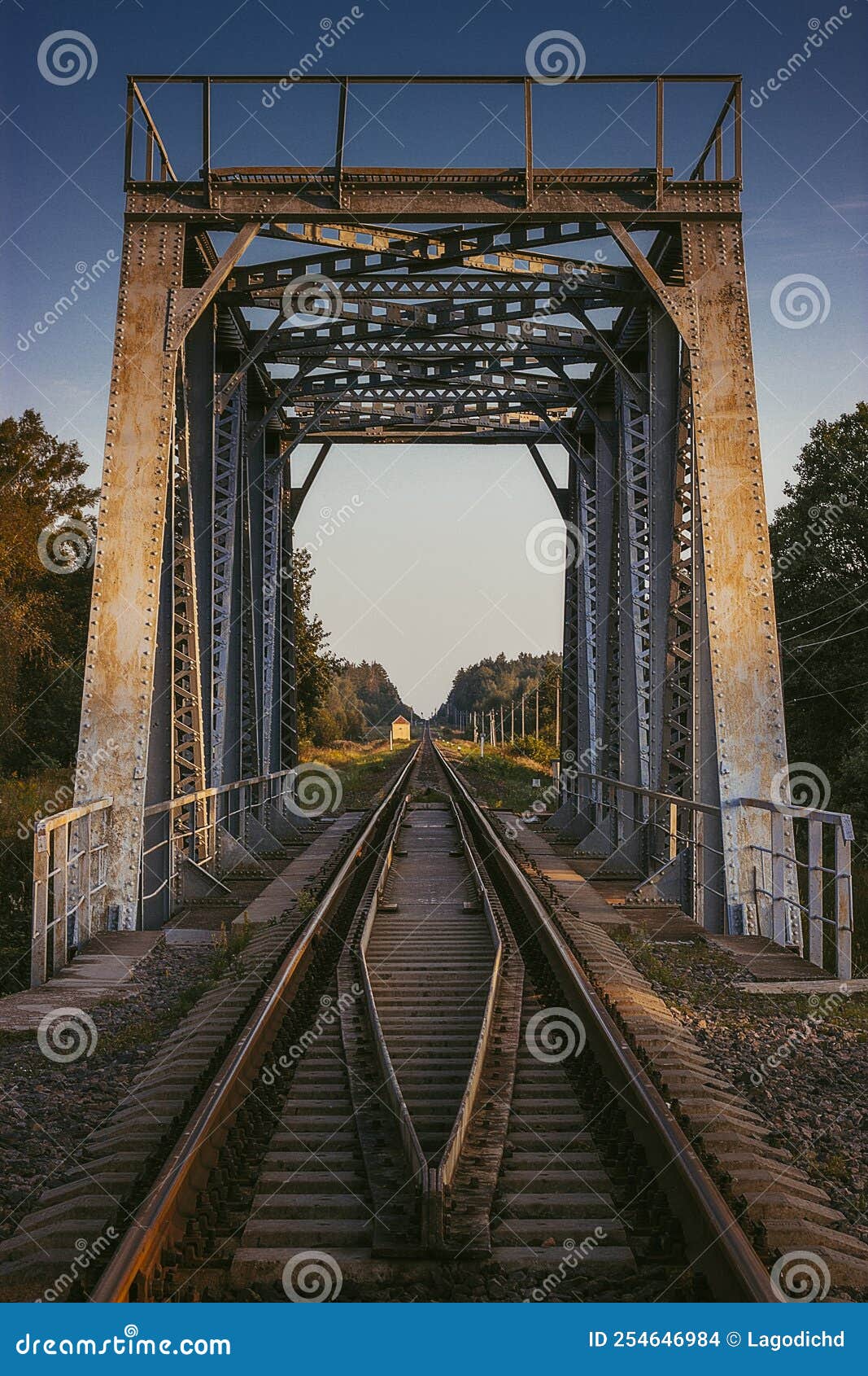 An Old Rusty Metal Railway Bridge on a Warm Summer Evening Stock Photo ...