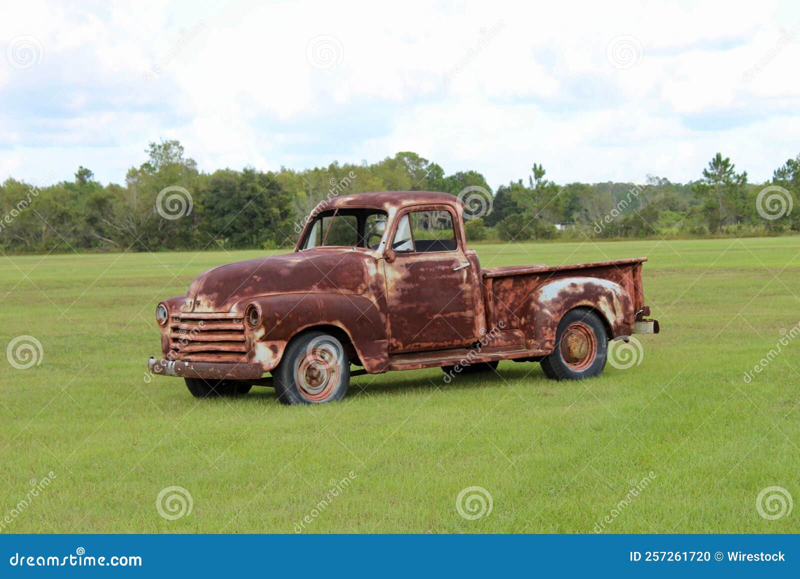 Old Rusty Pickup Car in the Green Field. Stock Photo - Image of lawn ...