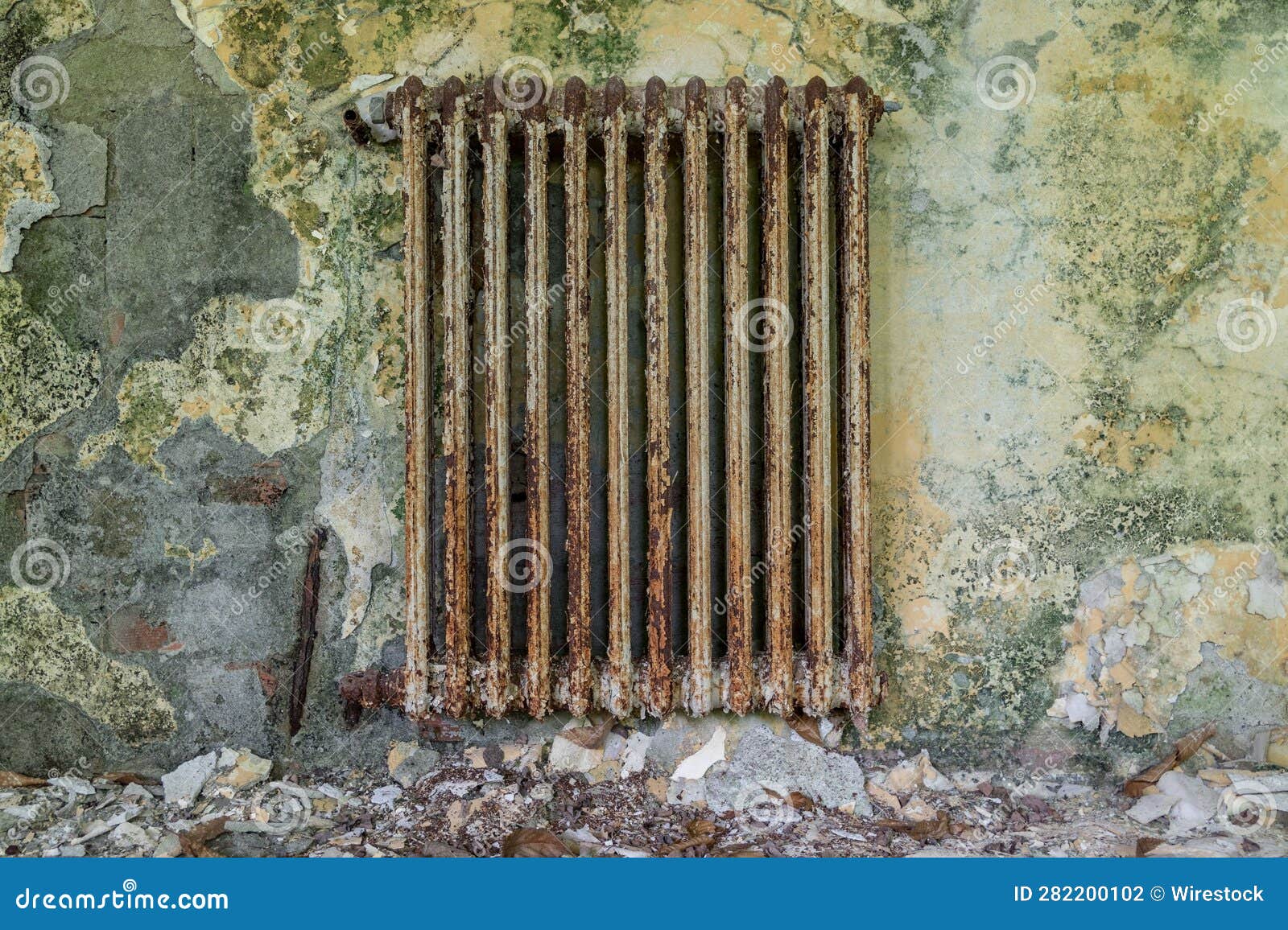 A Old Rusty Radiator on a Wall with Peeling Plaster Stock Photo - Image ...