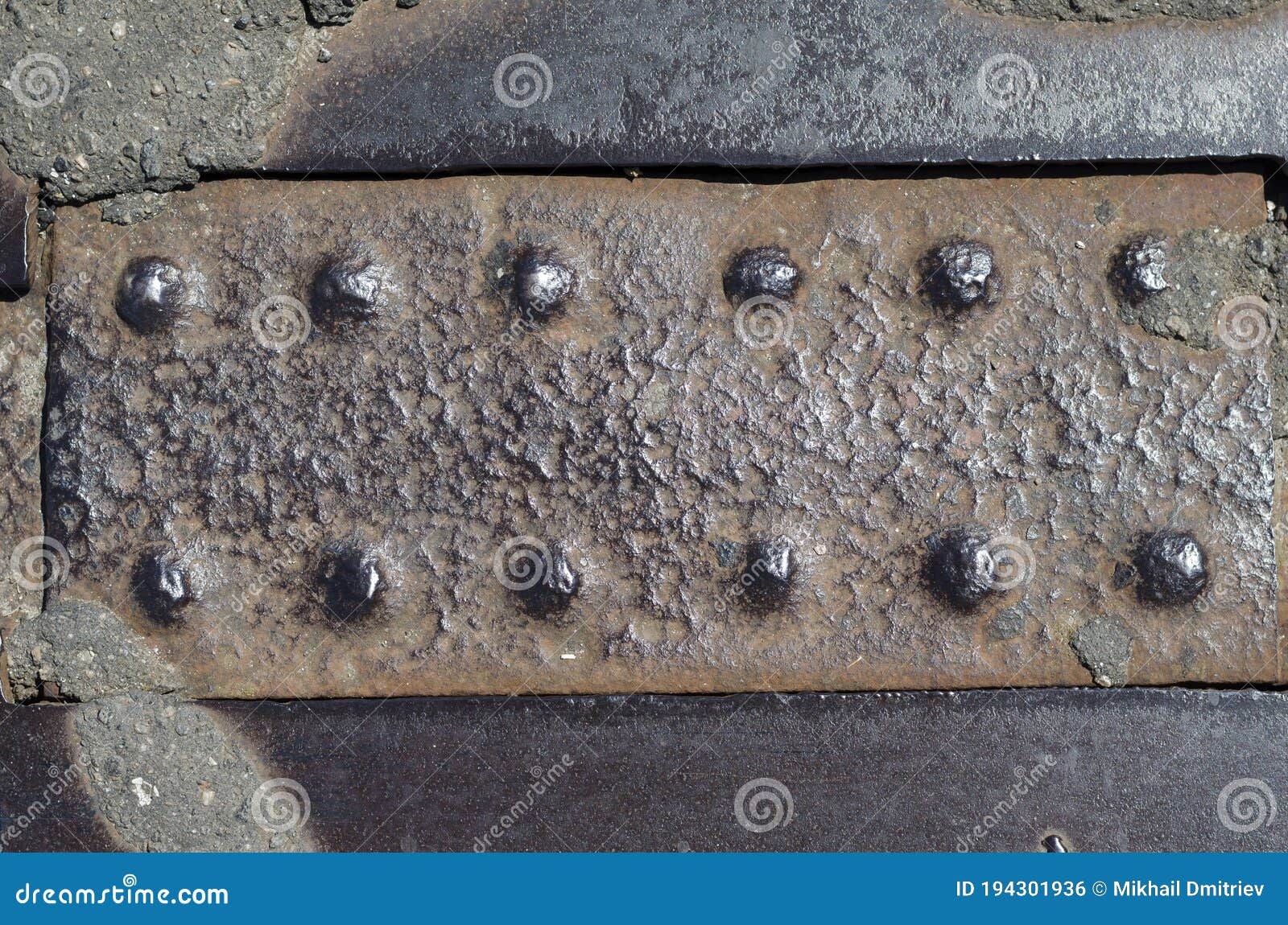 Old Rusty Rectangular Plate with Rivets on a Metal Surface Stock Photo ...