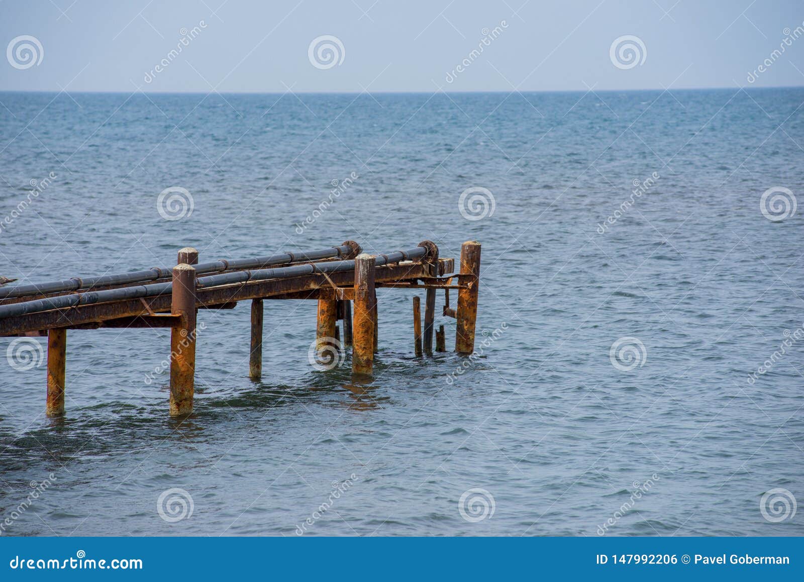 Old Rusty Sea Berth for Boats with Pipes Stock Photo - Image of light ...