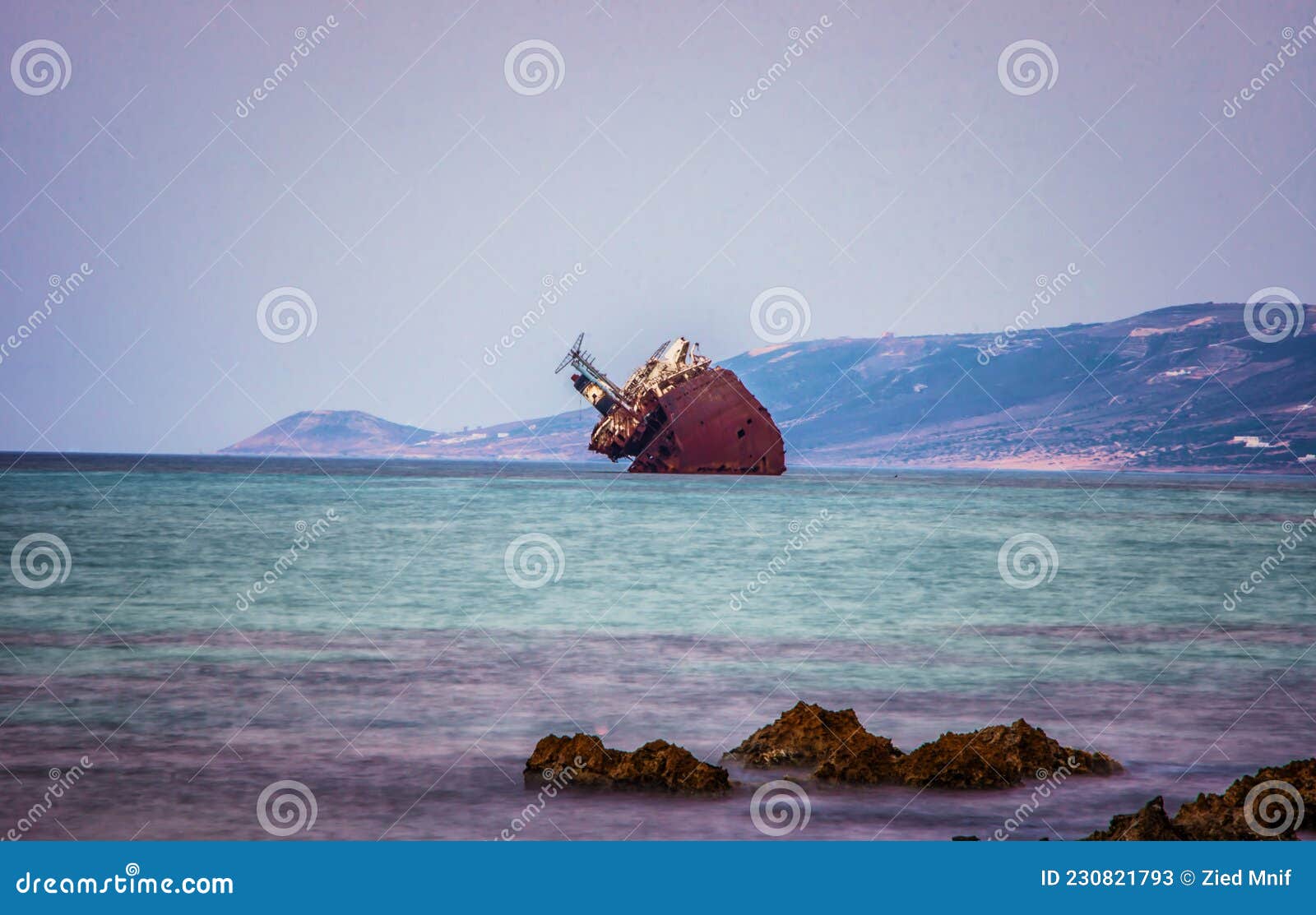 An Old Rusty Sinking Ship in the Sea by the Bay Stock Image - Image of ...