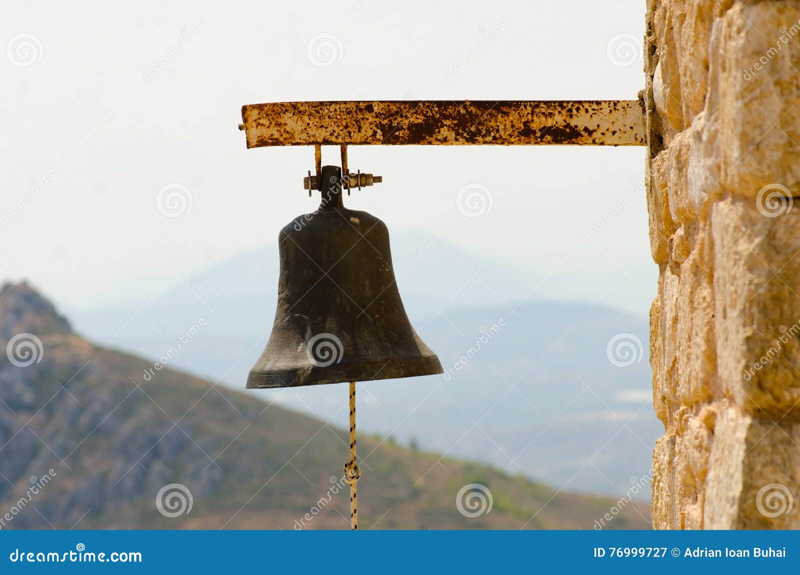 Old Rusty Steel Big Bell from Church with Rope on Stone Wall in Stock ...