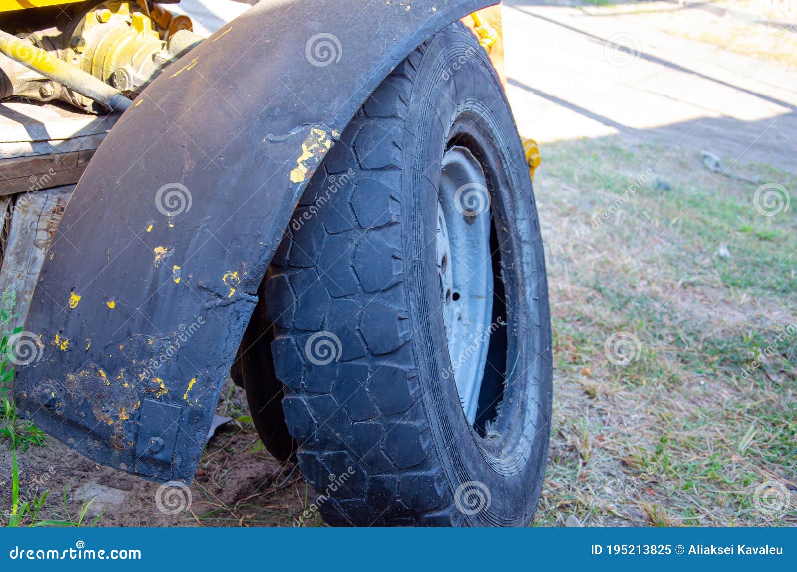 Old Rusty Tractor`s Flat Back Tire. Industrial Stock Image - Image of ...
