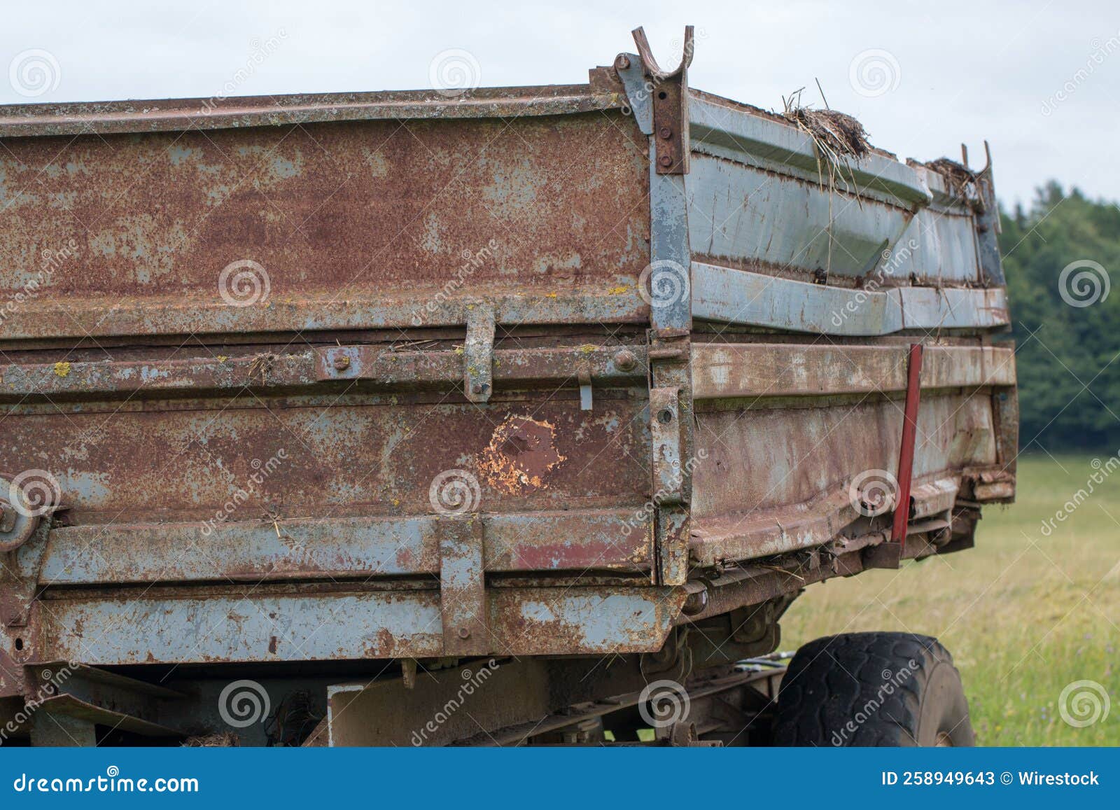 Old Rusty Tractor Trailer in the Green Field Stock Image - Image of ...