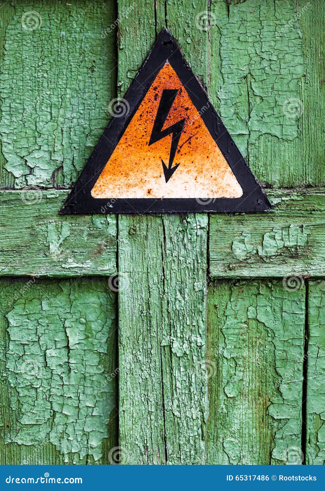 Old Rusty Warning High Voltage Sign on Cracked Wooden Surface Stock ...