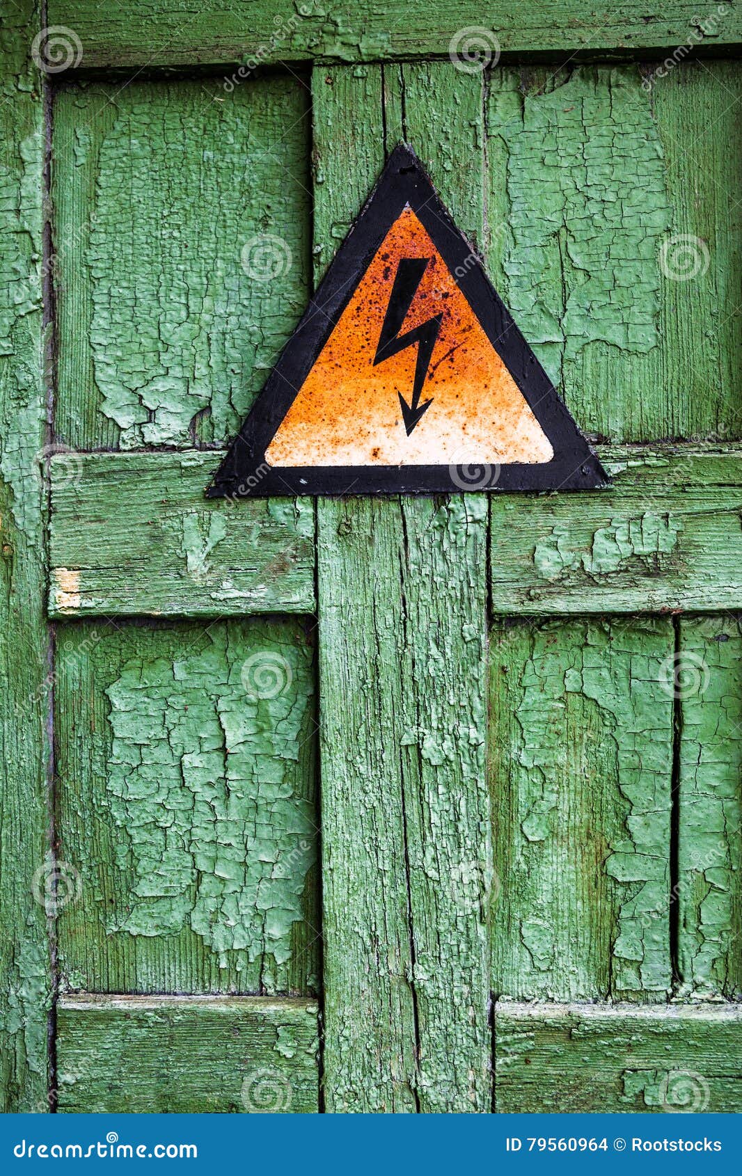 Old Rusty Warning High Voltage Sign on Cracked Wooden Surface Stock ...