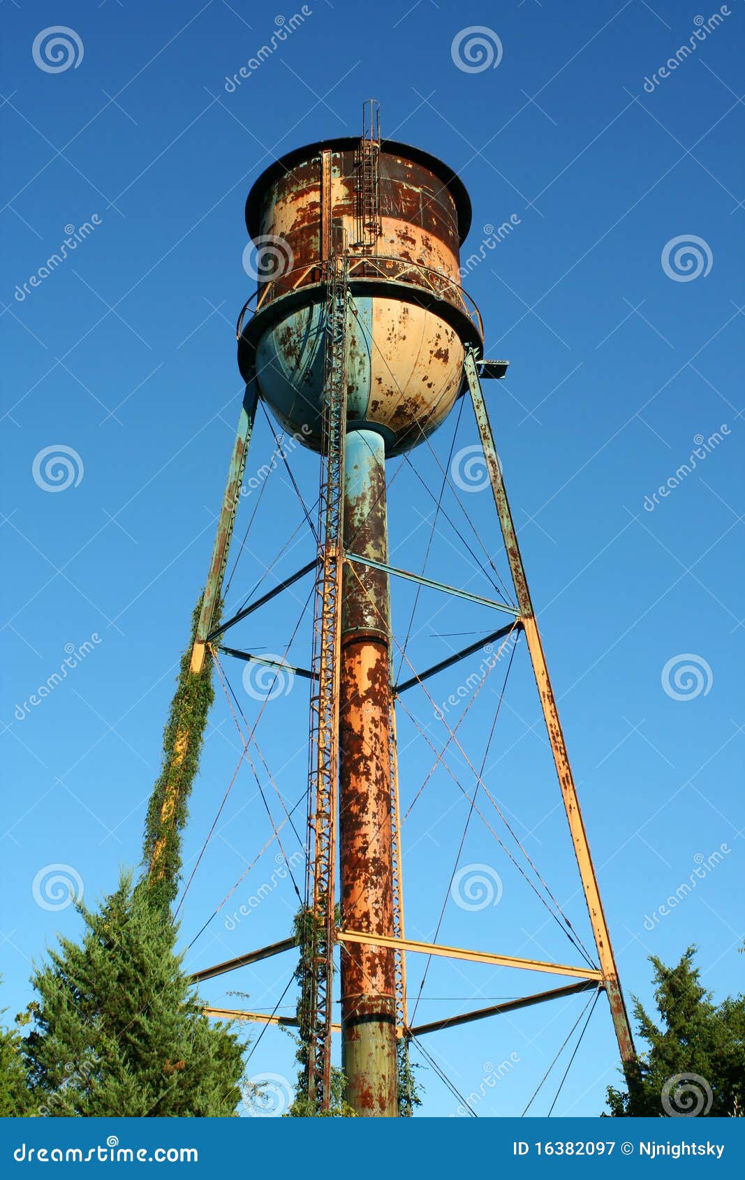 Old Rusty Watertower Against Blue Sky Stock Image - Image of utility ...