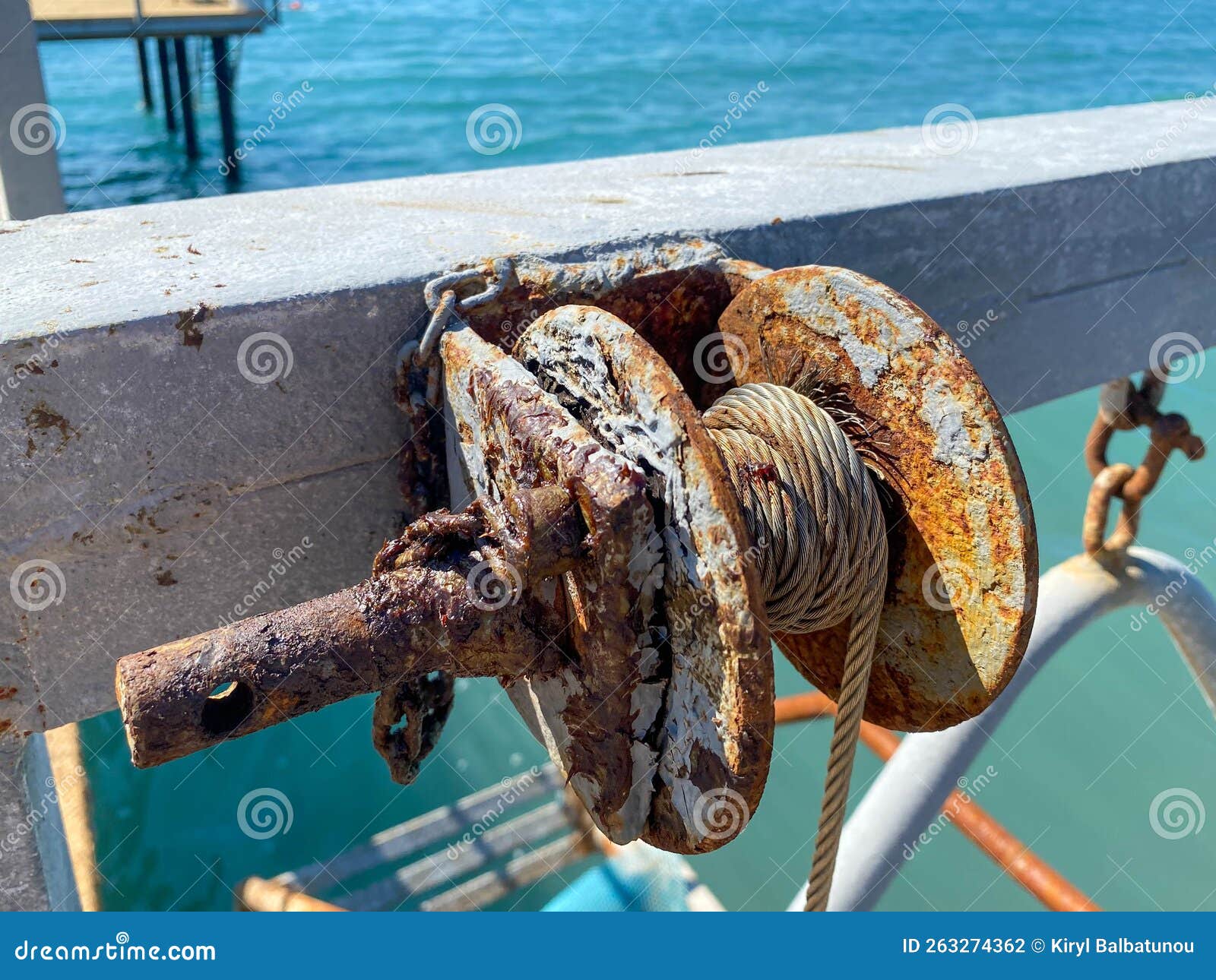 An Old Rusty Winch with an Iron Rope Rope on a Reel Stock Photo - Image ...