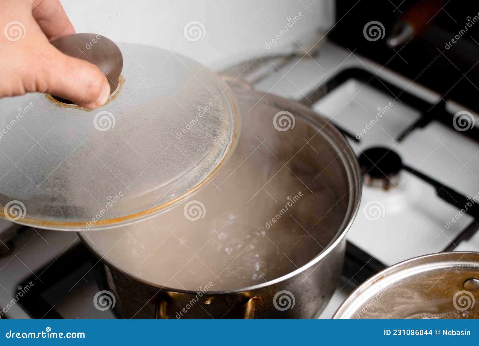 An Old Saucepan with Boiling Water and an Open Lid Stock Photo - Image ...