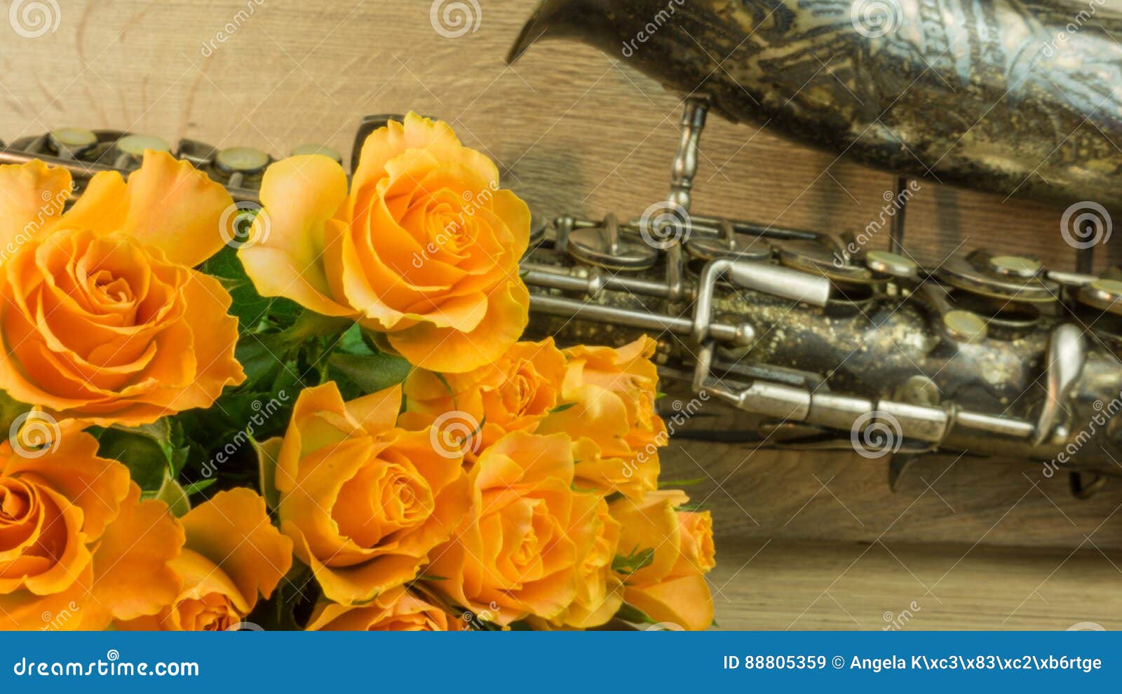 Old saxophone with roses stock image. Image of instrument - 88805359