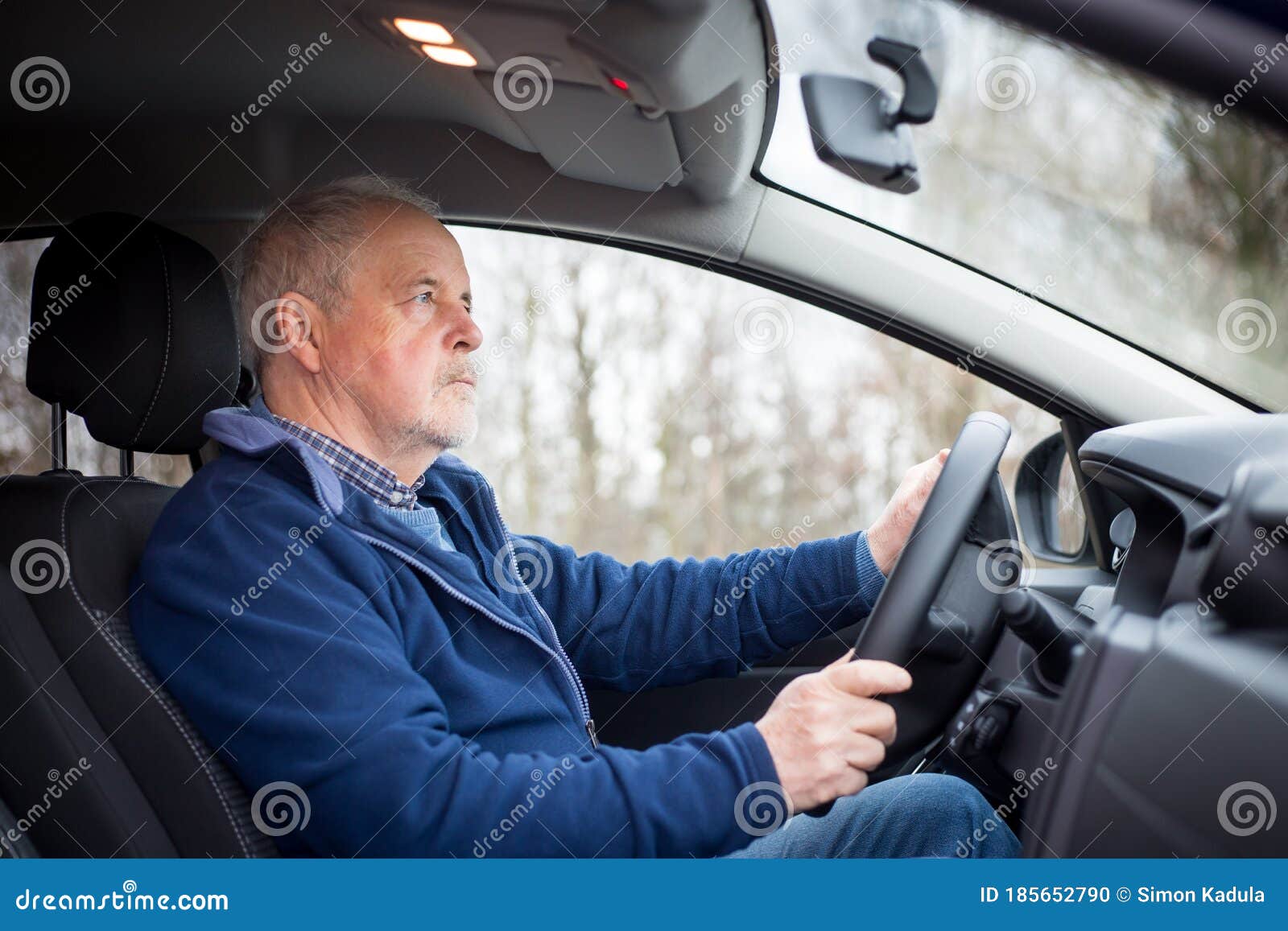 An Old Senior Man Driving a Modern Car, Transportation Concept Stock ...