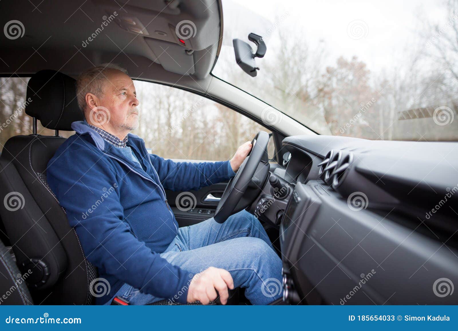 An Old Senior Man Driving a Modern Car, Transportation Concept Stock ...