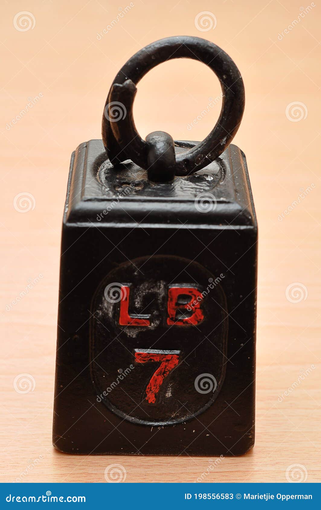 An old seven pound weight stock image. Image of instrument - 198556583