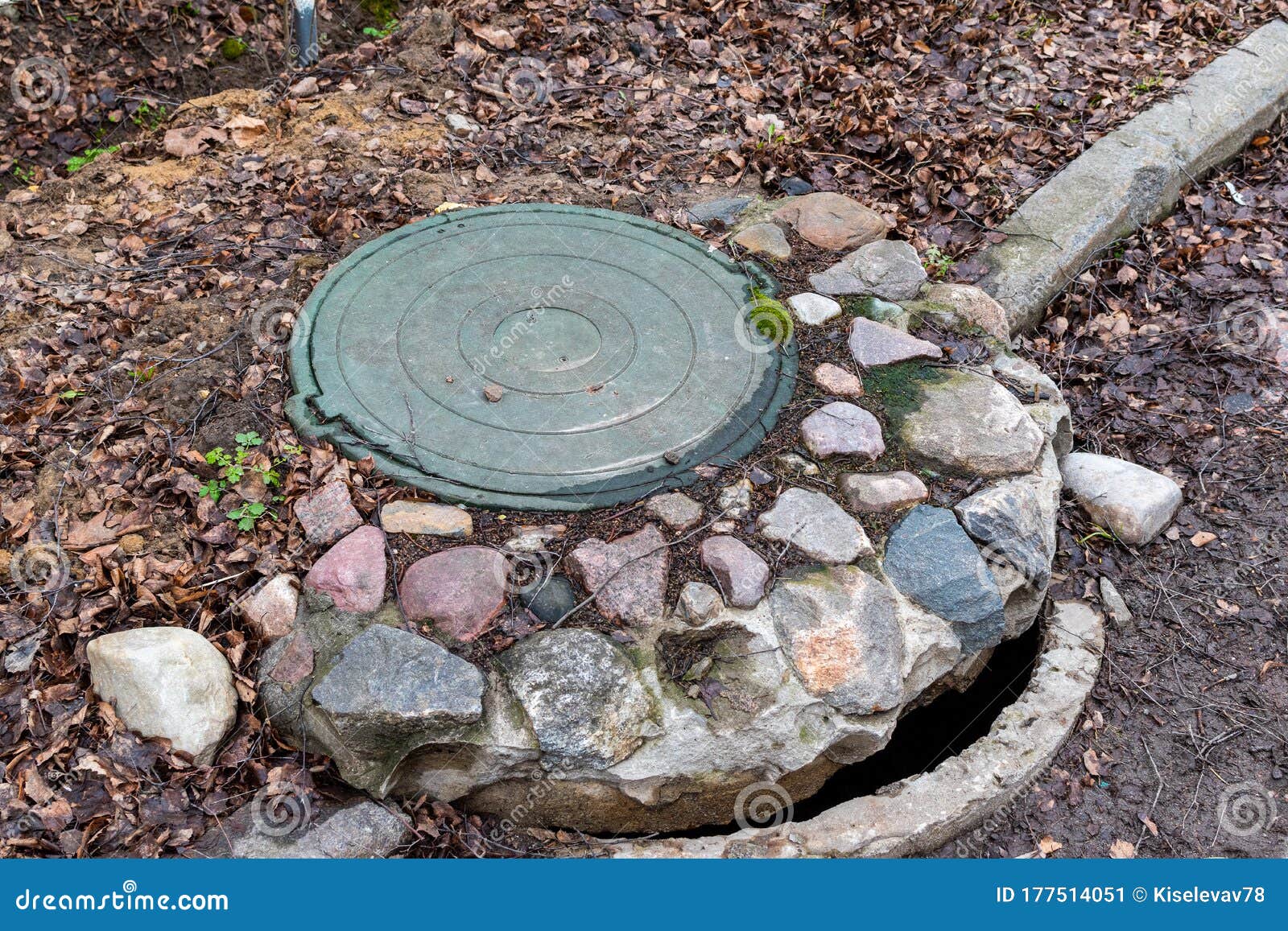 Old Sewer Manhole Decorated with Colored Stones Stock Image - Image of ...