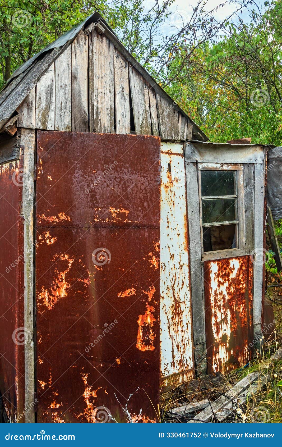 Old Shed Made of Wood and Rusty Metal Sheets. Abandoned Structure on a ...