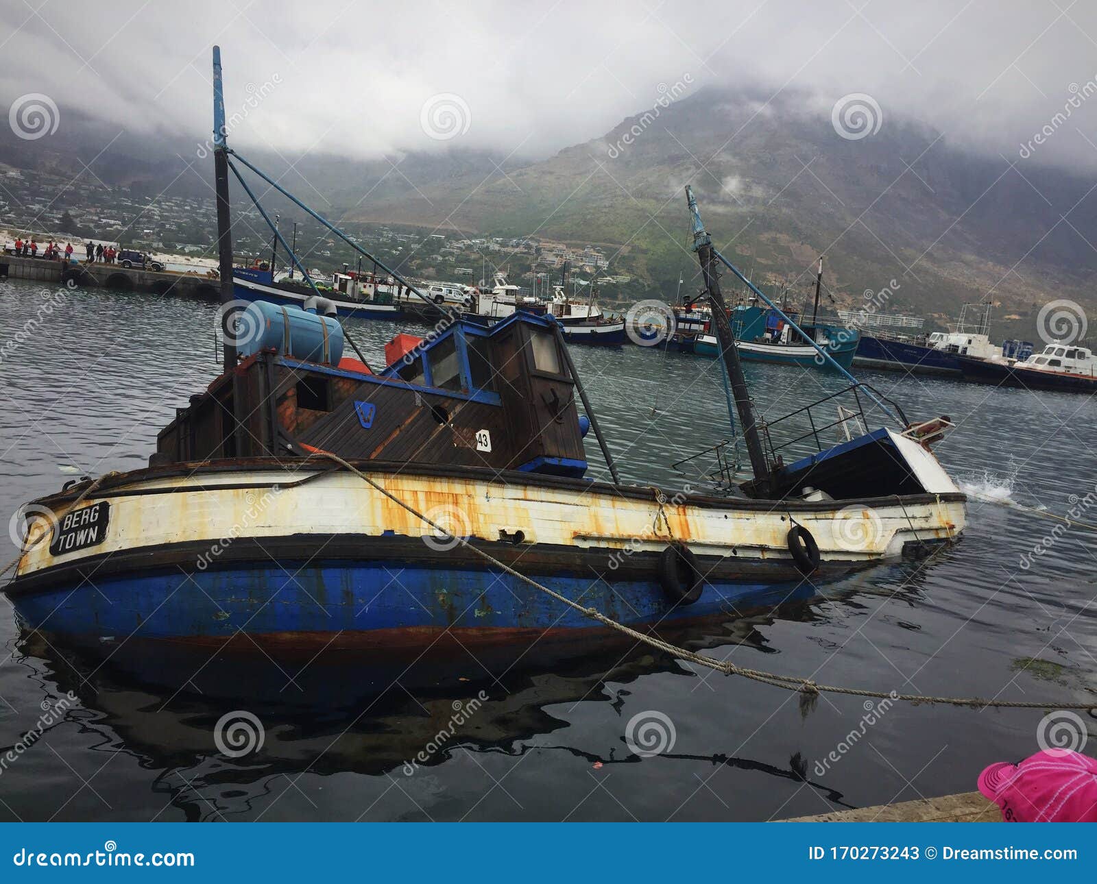 Old sinking boat in Harbor editorial stock photo. Image of town - 170273243