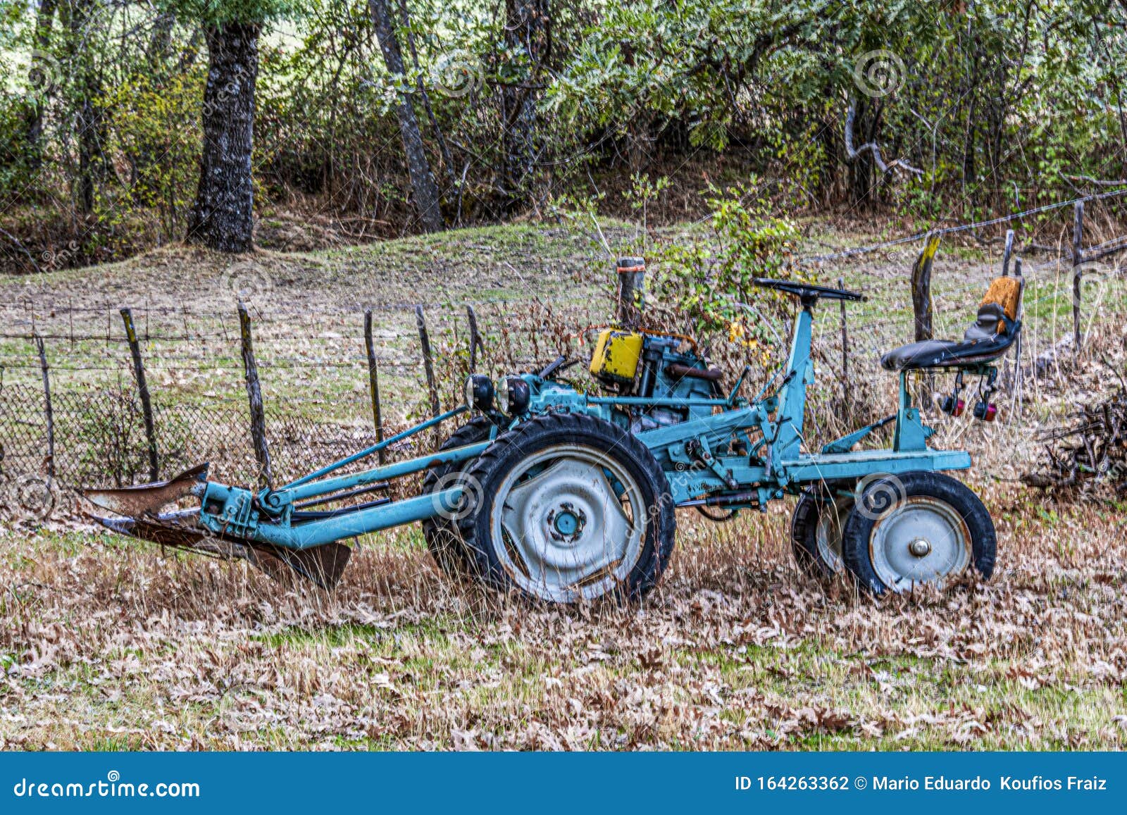 Old and Small Tractor with Its Tools for Plowing.madrid Spain Stock ...