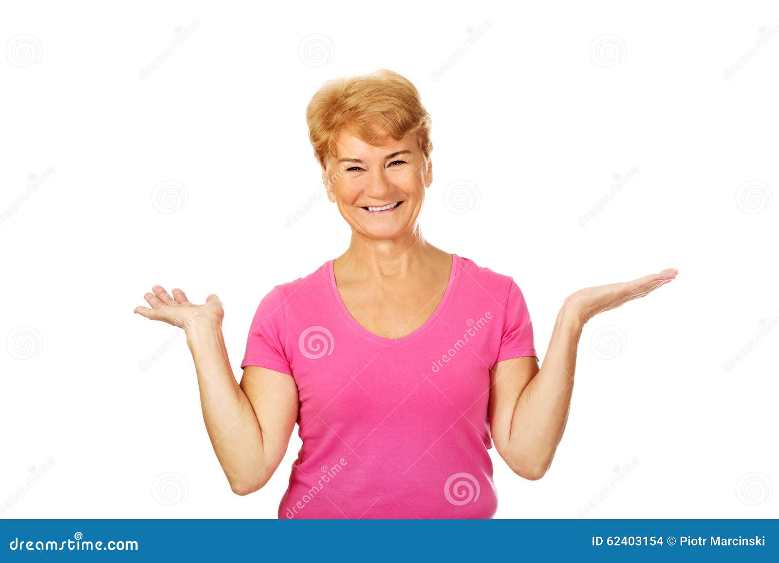 An Old Smiling Woman Presenting Something Stock Photo - Image of ...