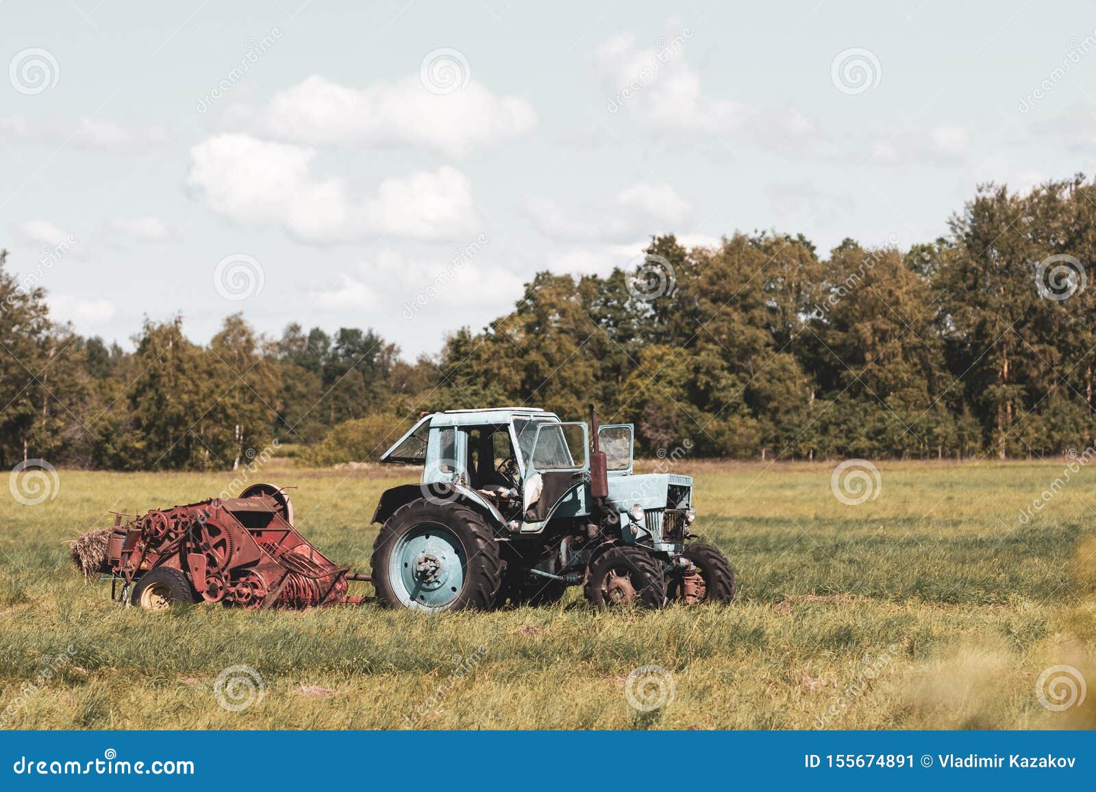 Old Soviet Tractor with Assembly in the Field. Stock Image - Image of ...