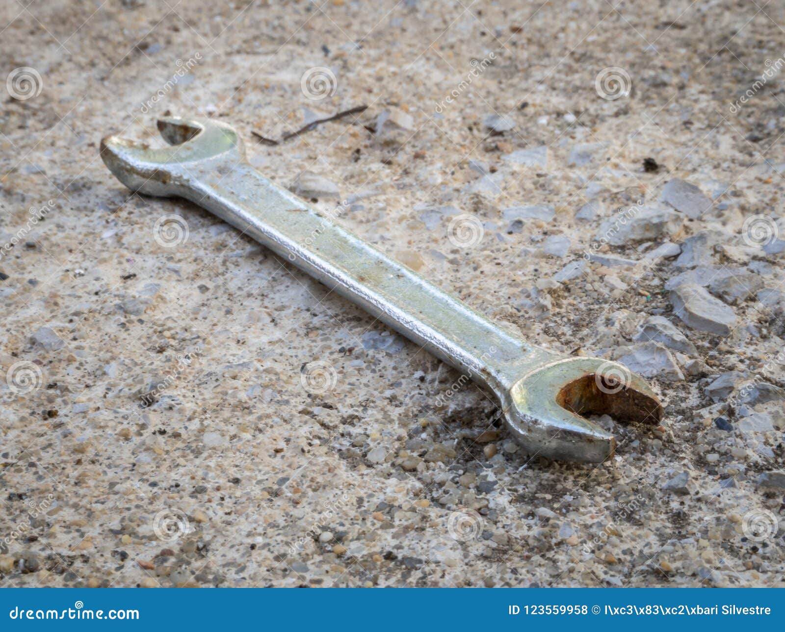 Old Spanner on a Concrete Grey Floor Stock Photo - Image of spanner ...