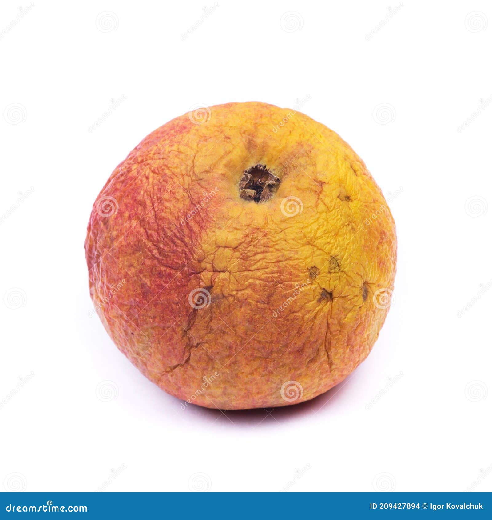 A Spoiled Apple With A Dark Spot With A Knife Stuck In It, And Two ...