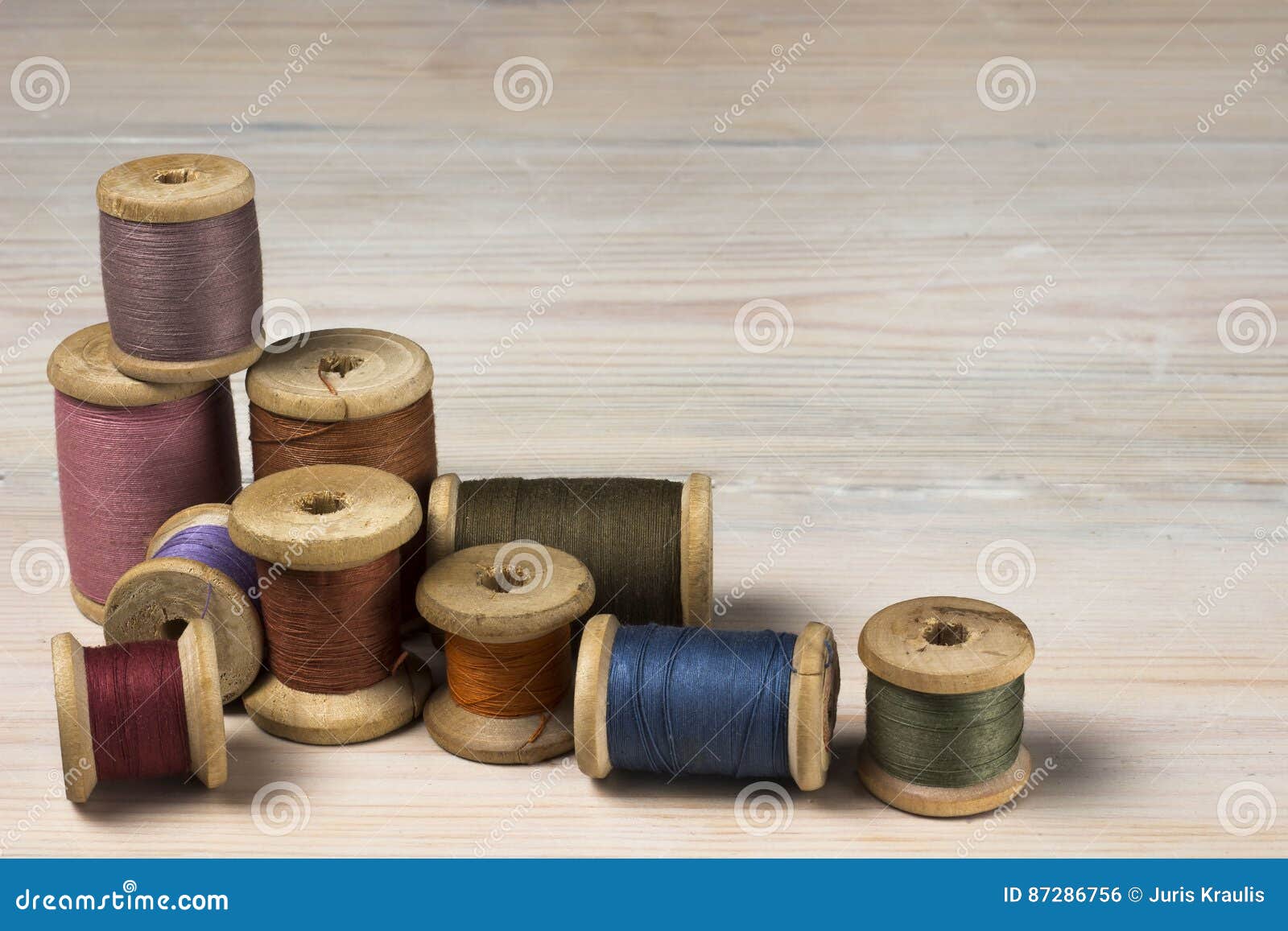Old Spools of Thread on Wooden Background Stock Photo - Image of ...