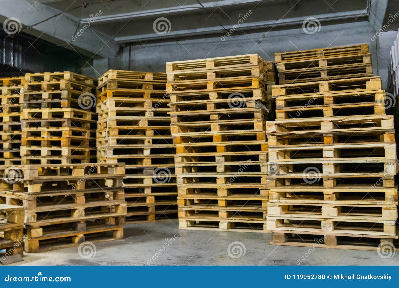 Stacked wooden pallets stock photo. Image of packing - 119952780