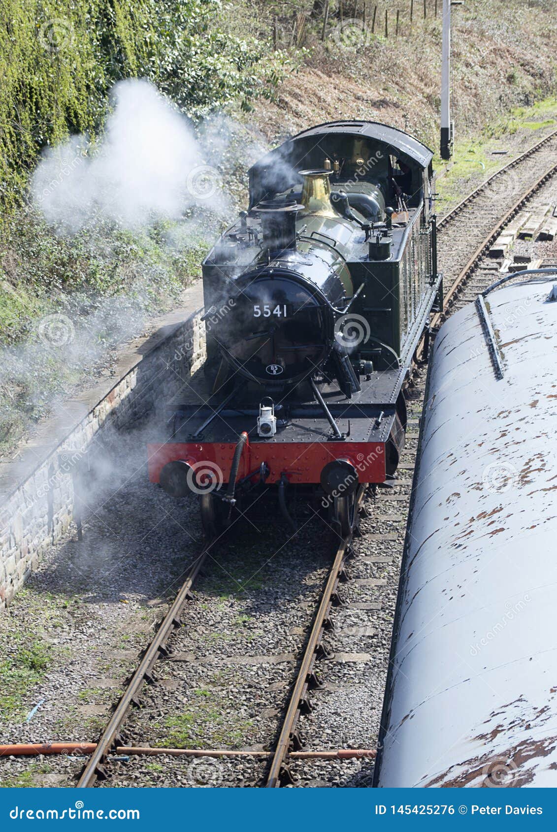 Old Steam Engine on Tracks Showing Puffs of Steam Stock Photo - Image ...