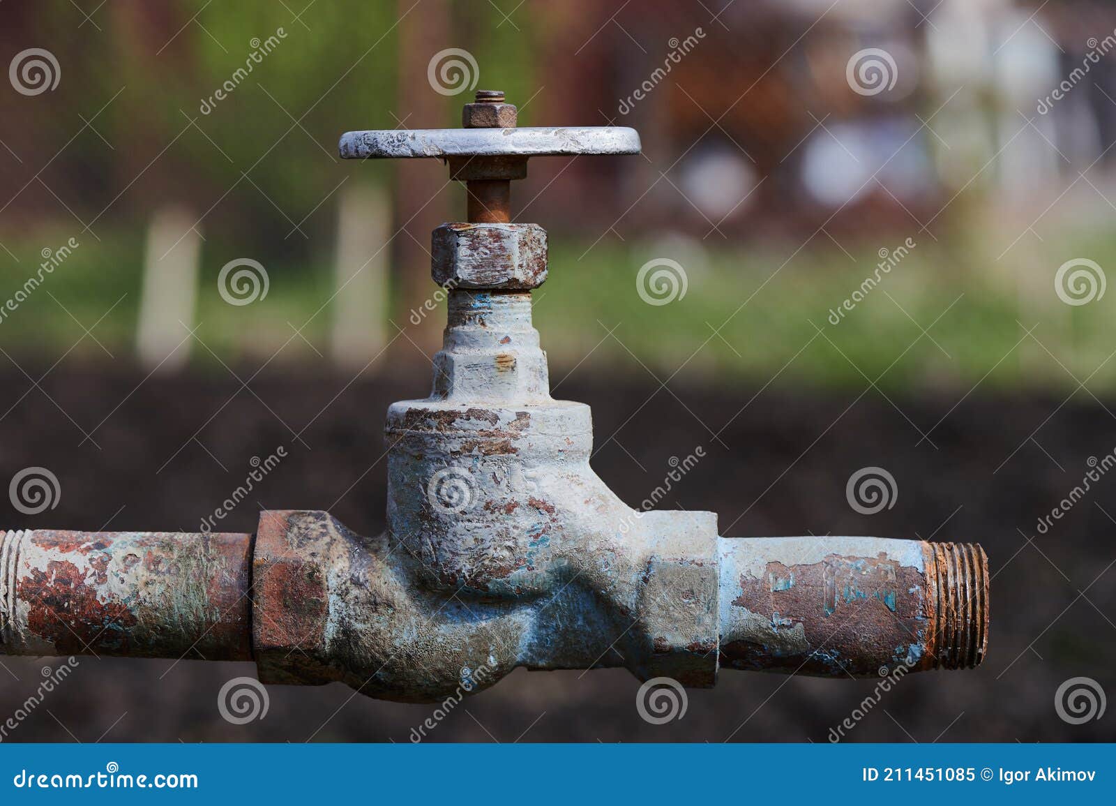 Old Steel Water Tap of an Outdated Design Outdoors, Covered in Peeling ...