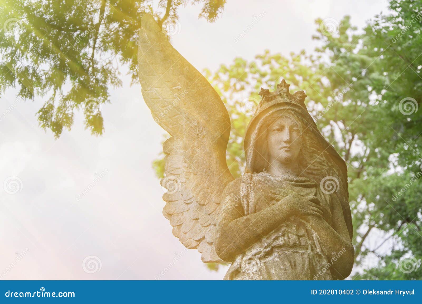 Old Stone Angel in Sun Rays Stock Photo - Image of angel, emotion ...