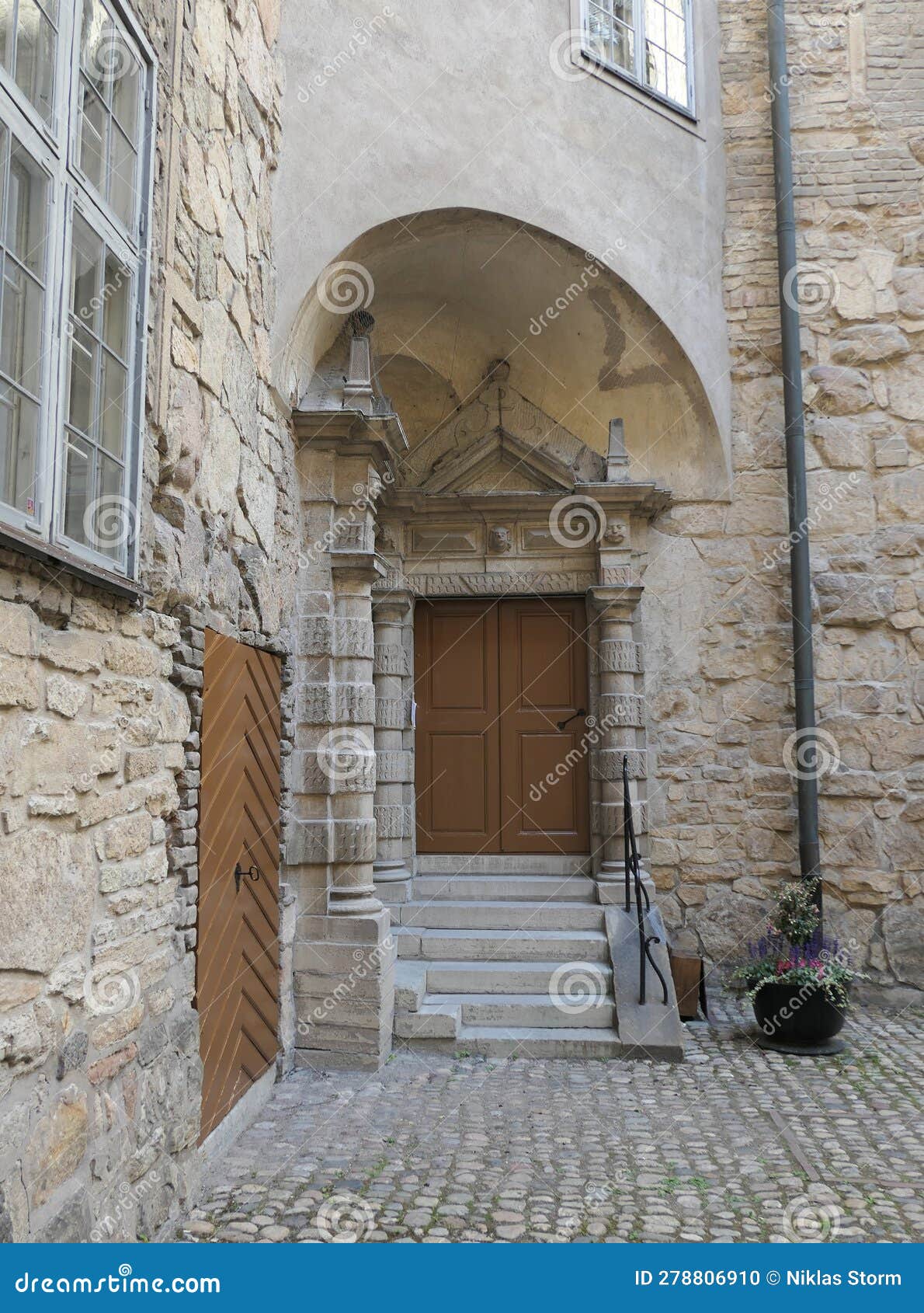 A Old Stone Building with Doors and Stairsteps Stock Photo - Image of ...